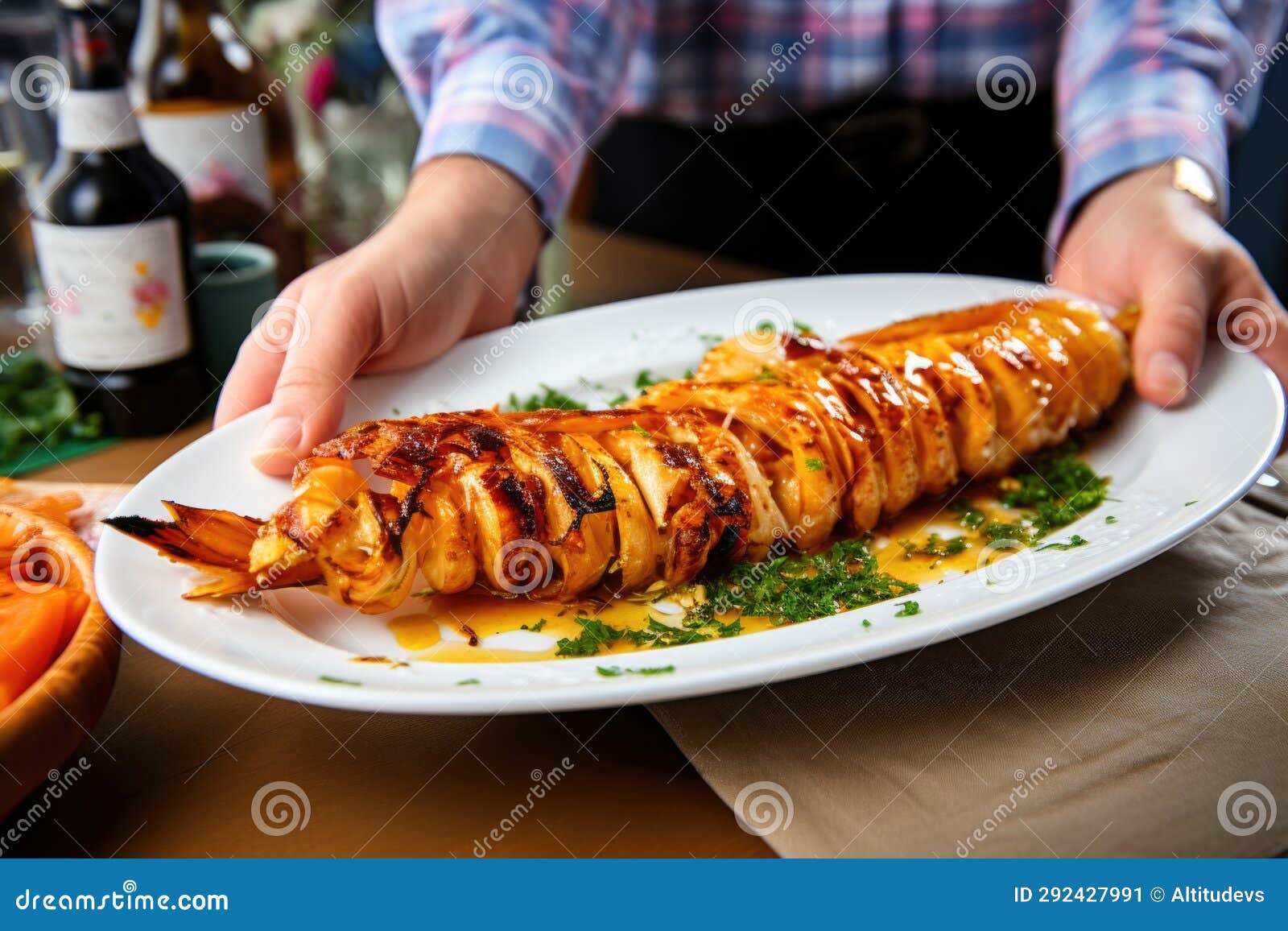 Hand Showing Off Barbecued Squid Beautifully Presented on a Plate Stock ...