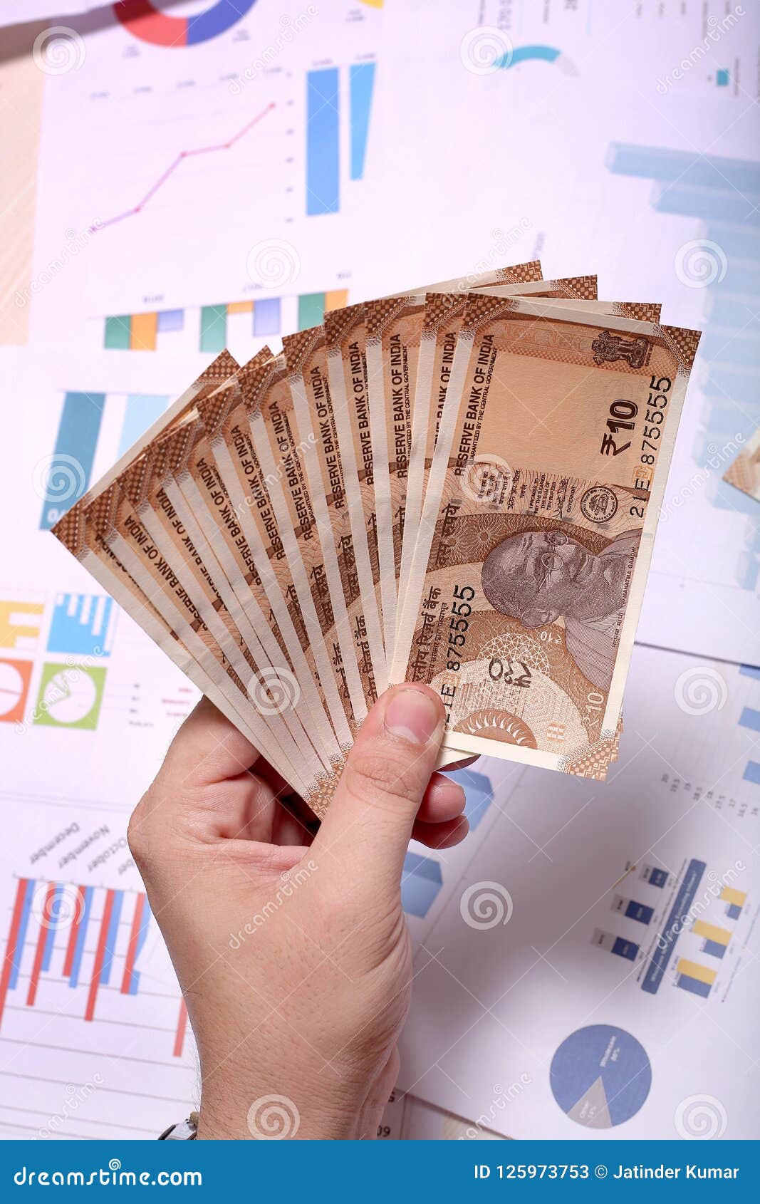 Hand Showing Spread of New Indian 10 Rupee Currency Notes Stock Image ...