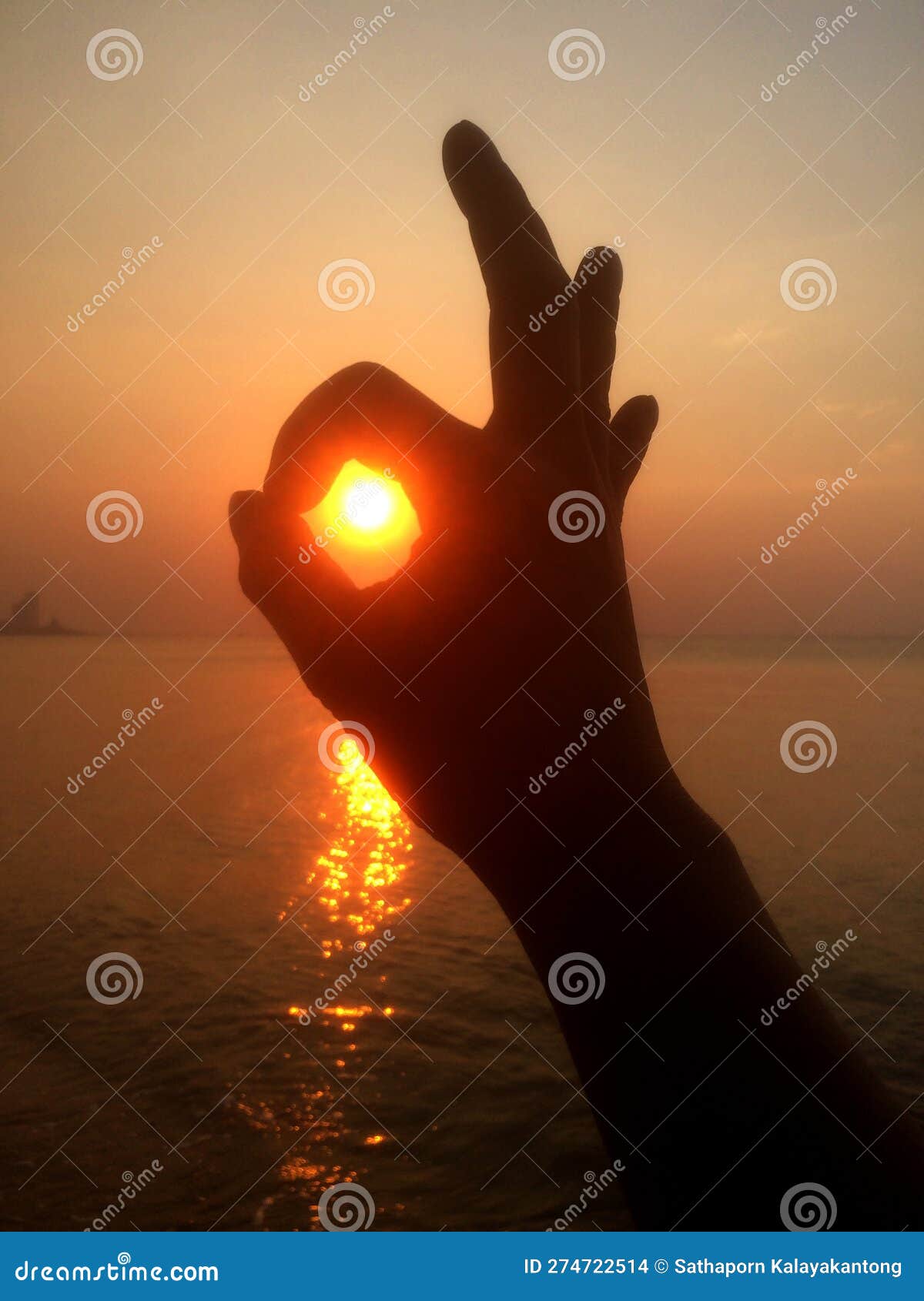 Hand Sign and Sun Rays Going through Hands at Sunset Stock Photo ...
