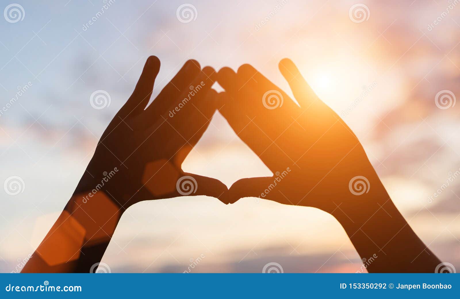 Hands Forming a Shape with Sunset Silhouette Stock Photo - Image of ...
