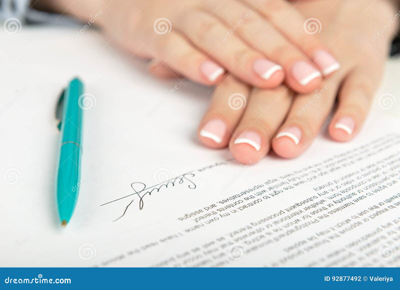 Hand signing a contract stock photo. Image of business - 92877492