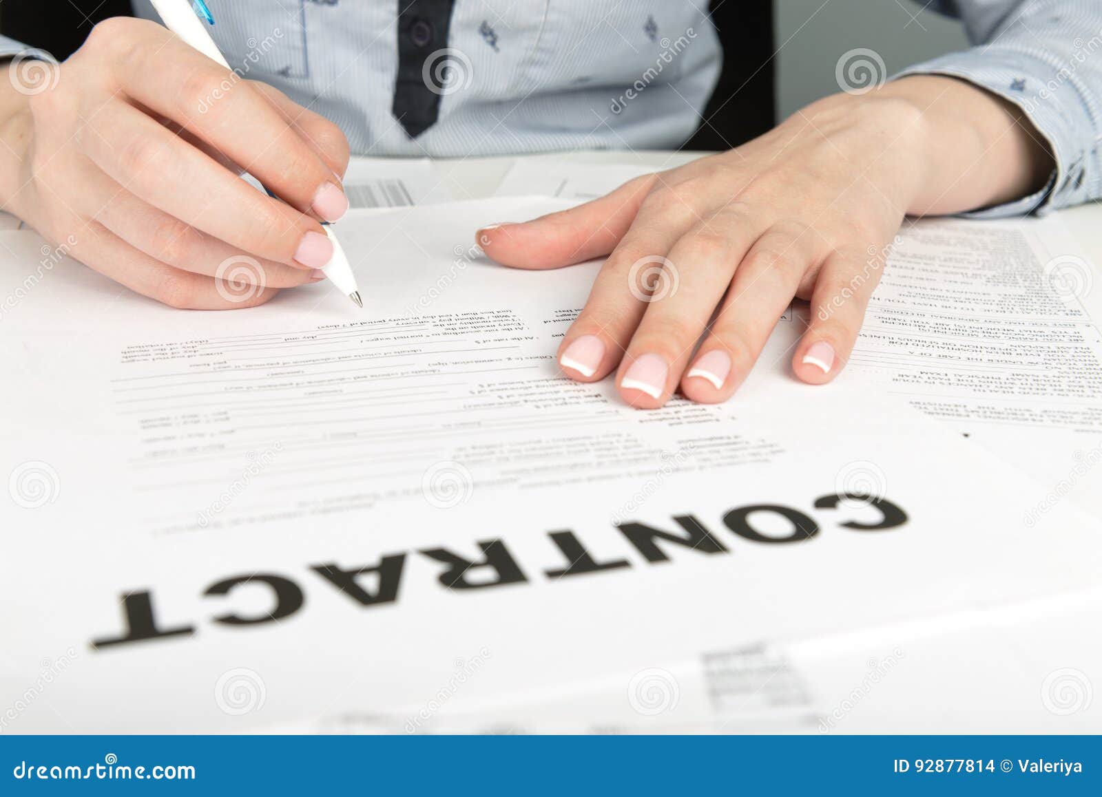 Hand signing a contract stock photo. Image of executive - 92877814