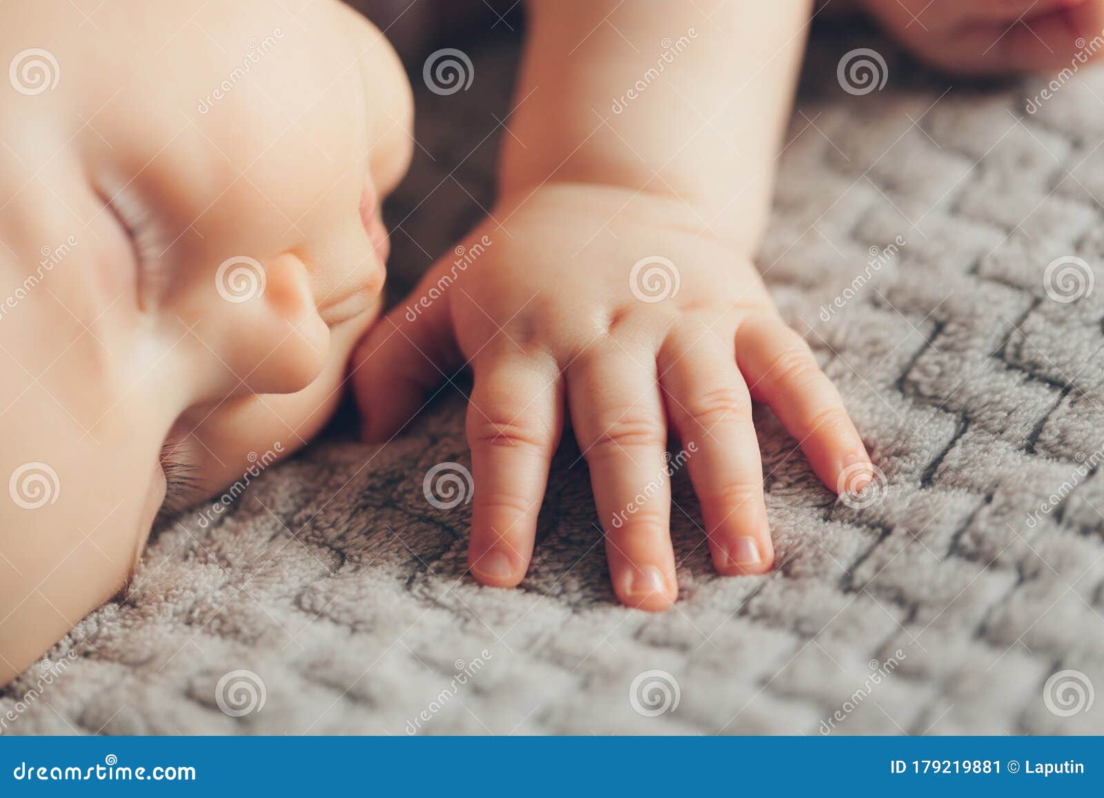Hand Of Baby Shows Thumbs Up Gesture. Kid Wear Warm Jacket Show Gesture ...