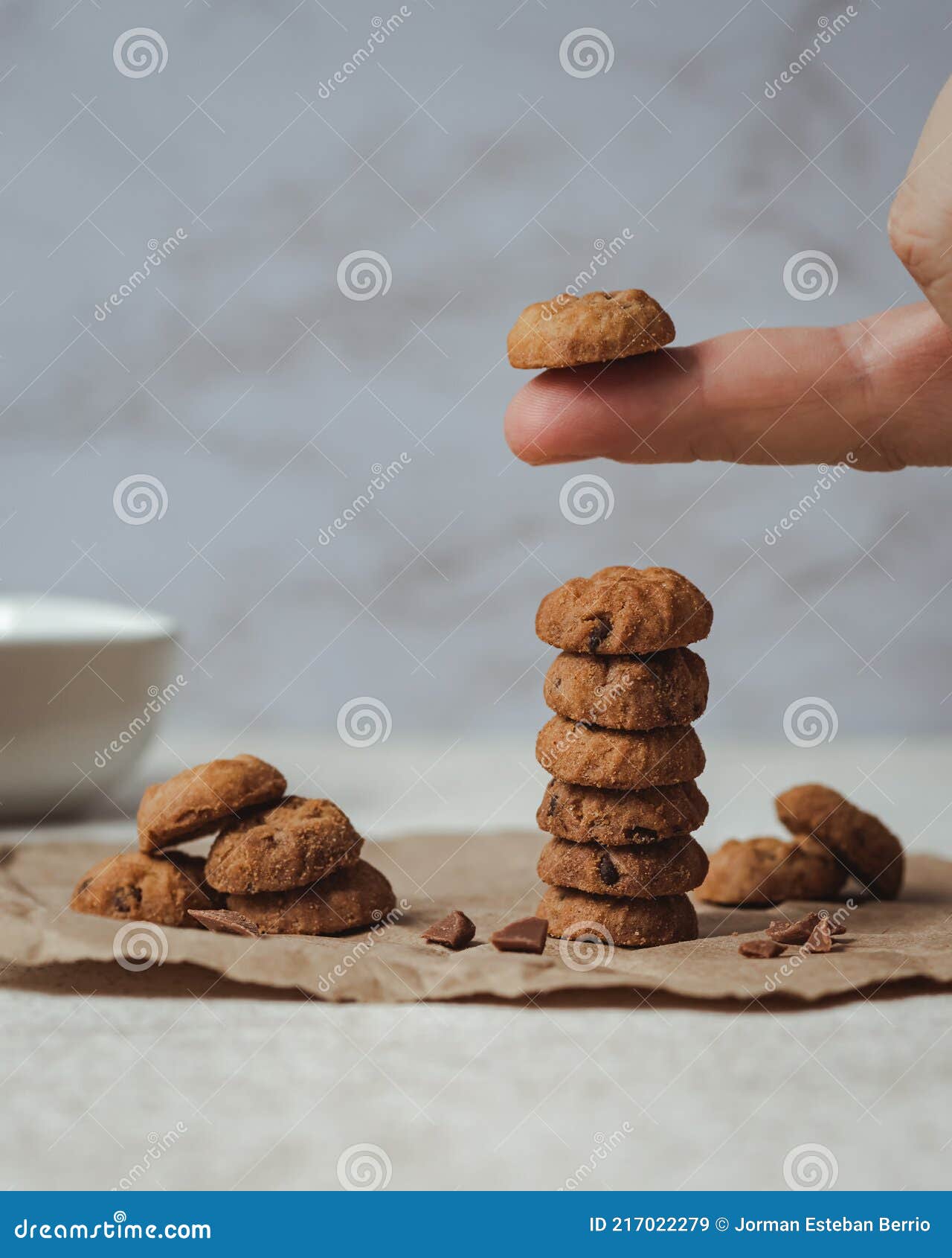 Hand with a Small Chocolate Chip Cookie on the Finger Stock Image ...