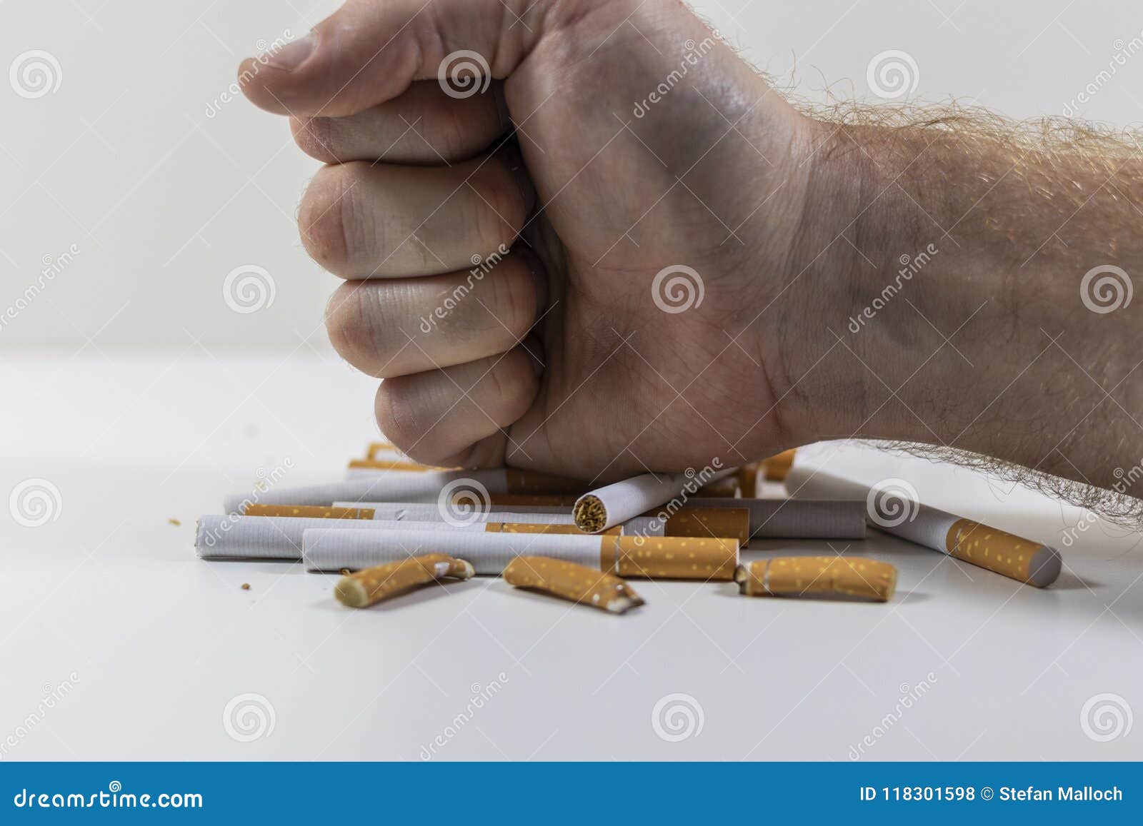 A Hand Smashing Cigarettes Close Up Stock Photo - Image of break ...