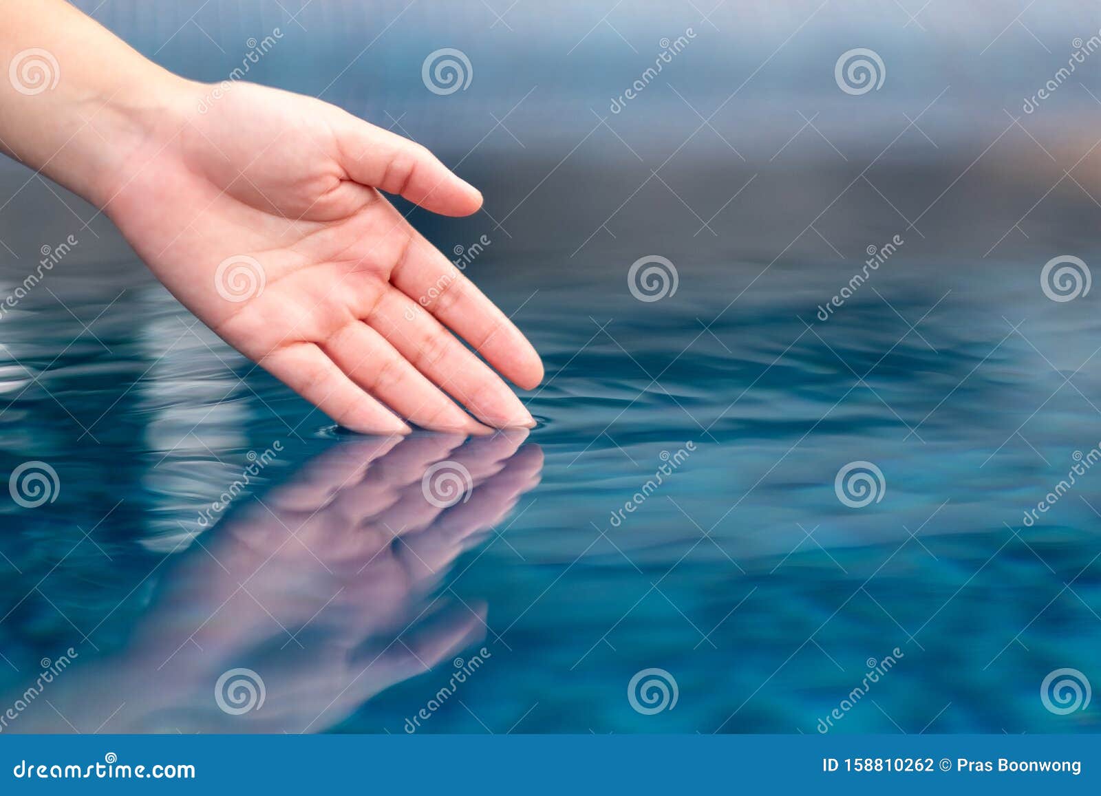 A Hand Soaking into Clear Water Stock Photo - Image of hand, purity ...