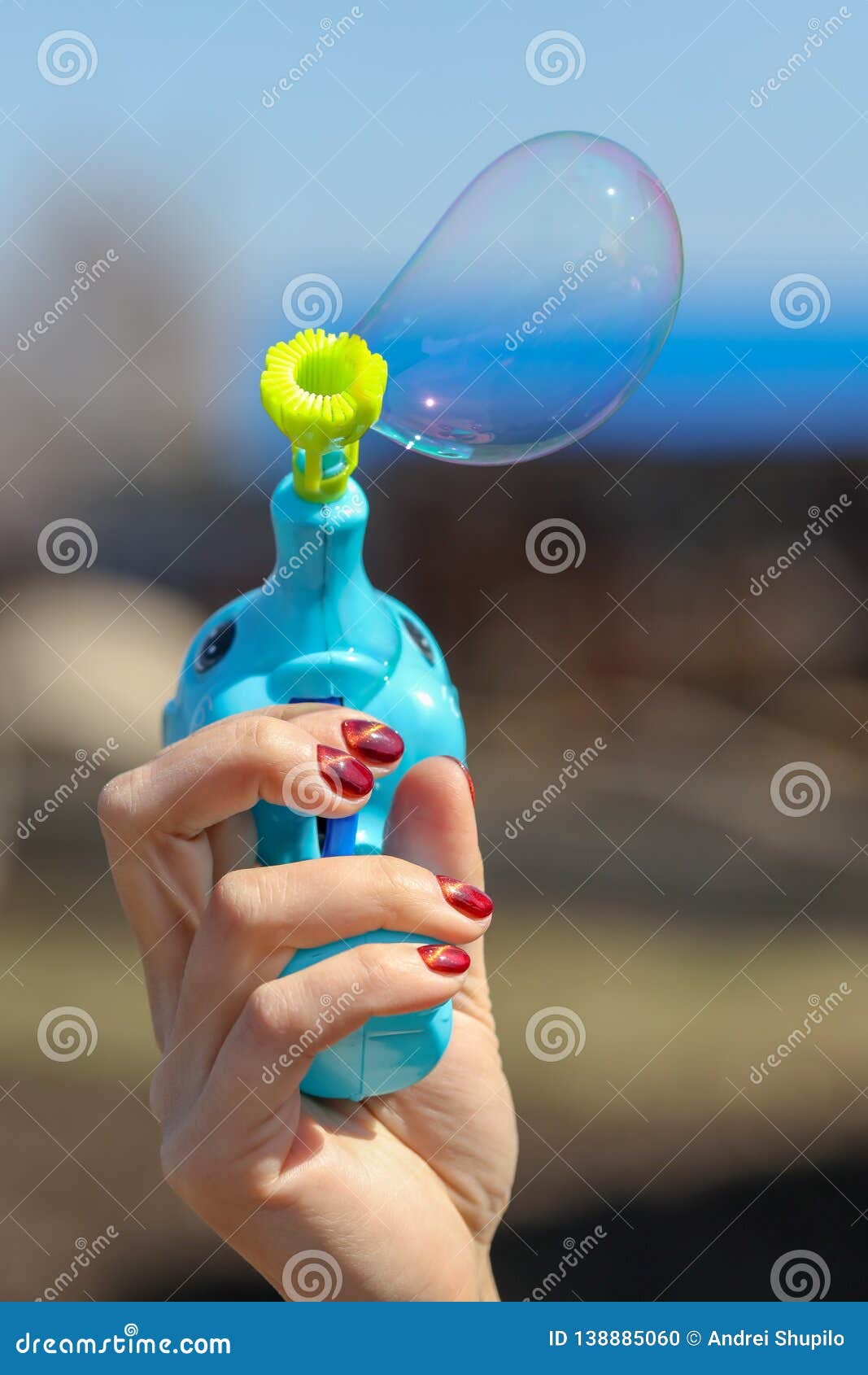 Hand with Soap Bubbles Against the Blue Sky Stock Photo - Image of ...