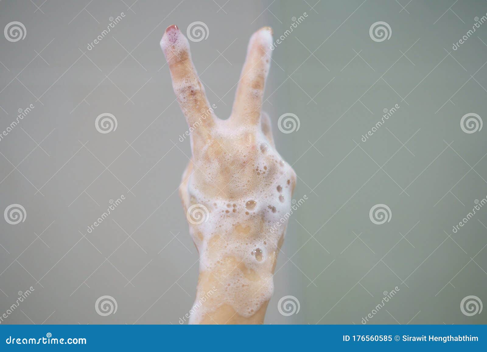 Hand with Soft Foam Bubble from Soap is Showing Victory Sign Stock ...