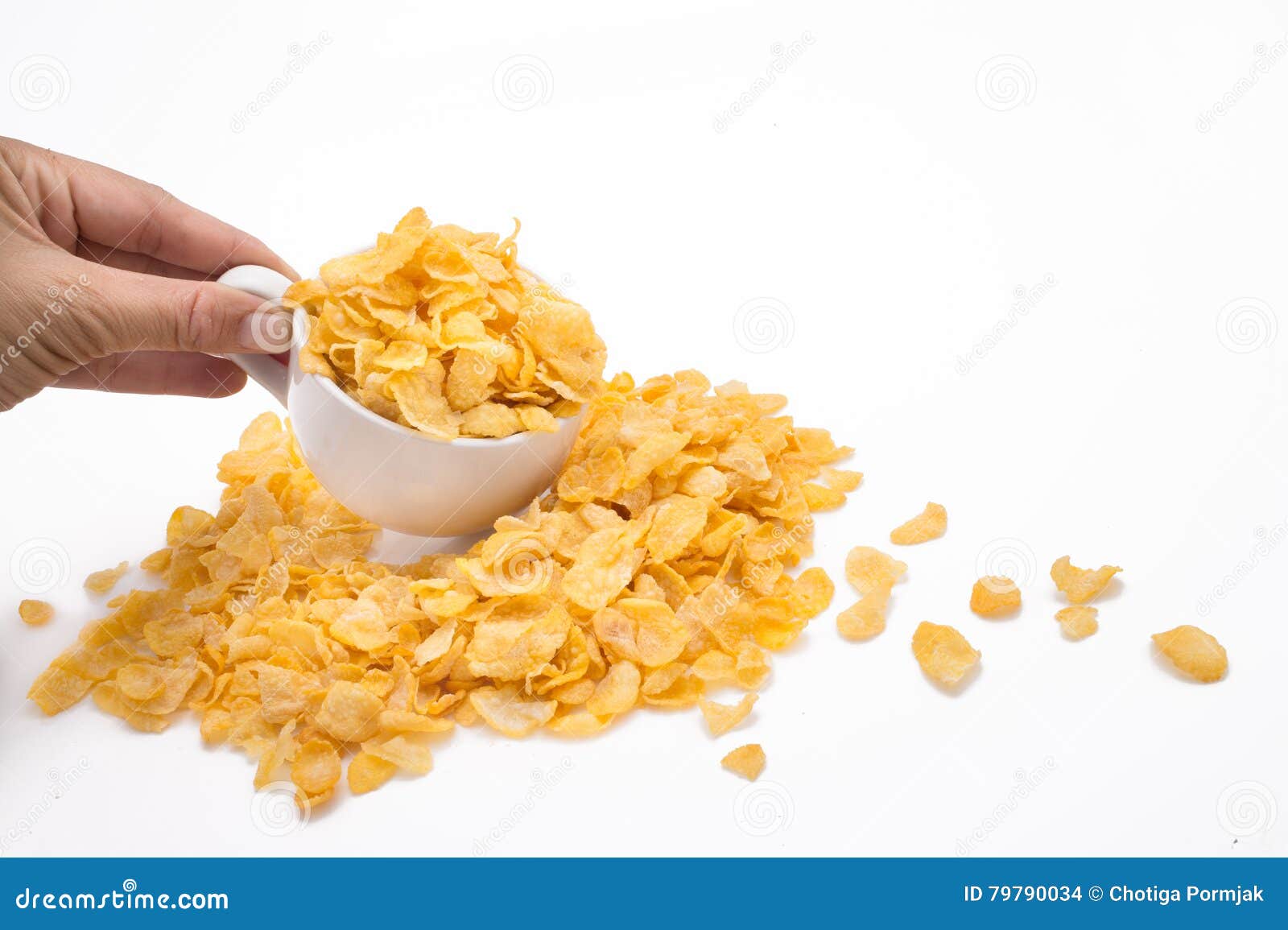 Hand Spilling Corn Flakes Out Of Tiny Cup Royalty-Free Stock Image ...