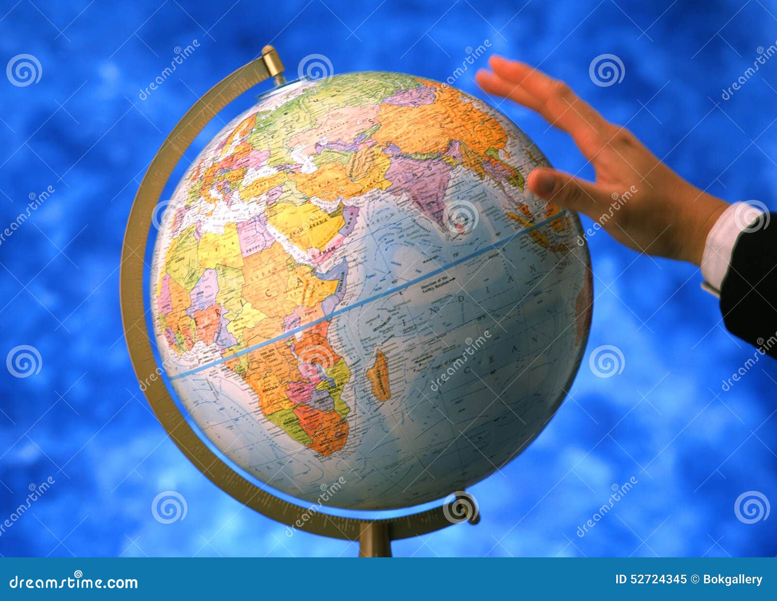 Hand spinning globe stock image. Image of international - 52724345