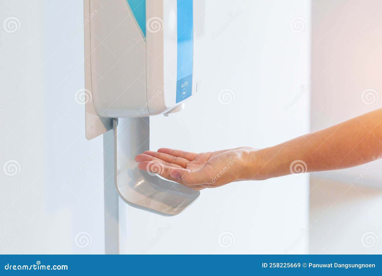 Hand Spray by Automatic Sanitizer Dispenser in Office or Apartment ...