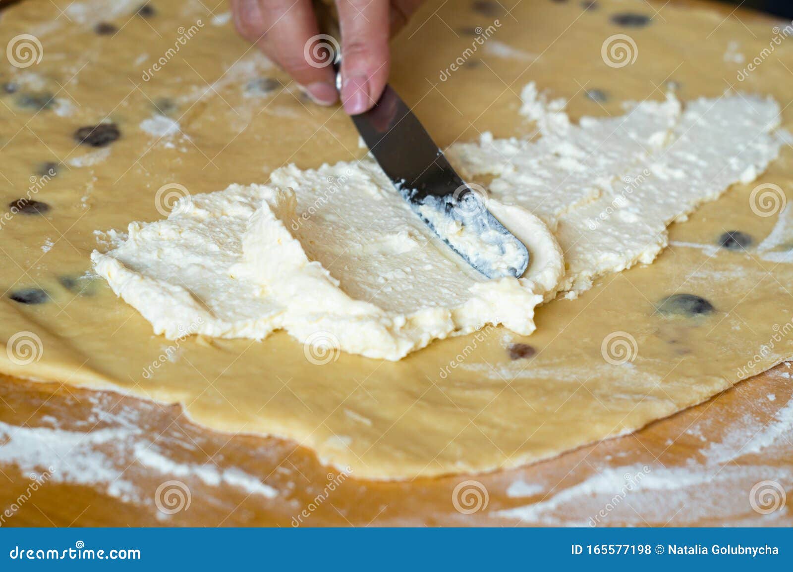 Spreading the Curd Filling with a Knife on the Dough Stock Photo ...