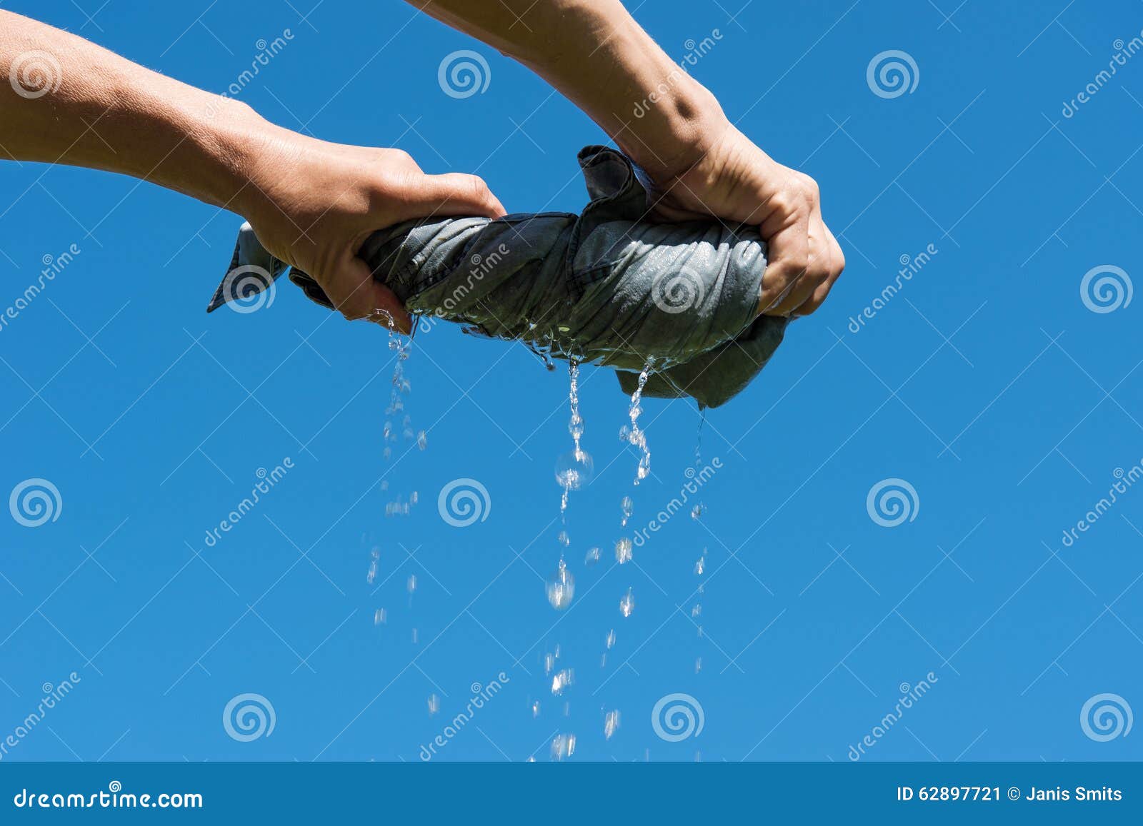 Hand squeezing cloth. stock image. Image of summer, drop - 62897721