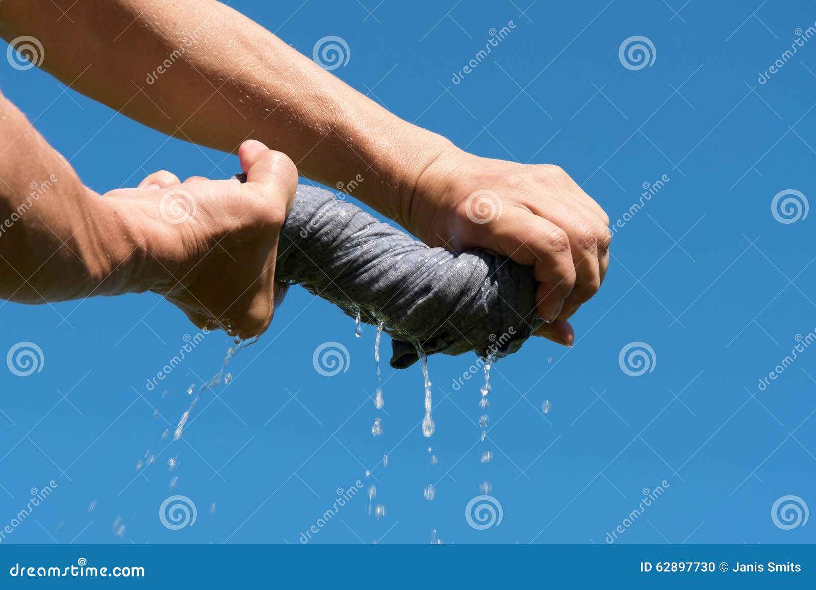 Hand squeezing cloth. stock photo. Image of drying, human - 62897730