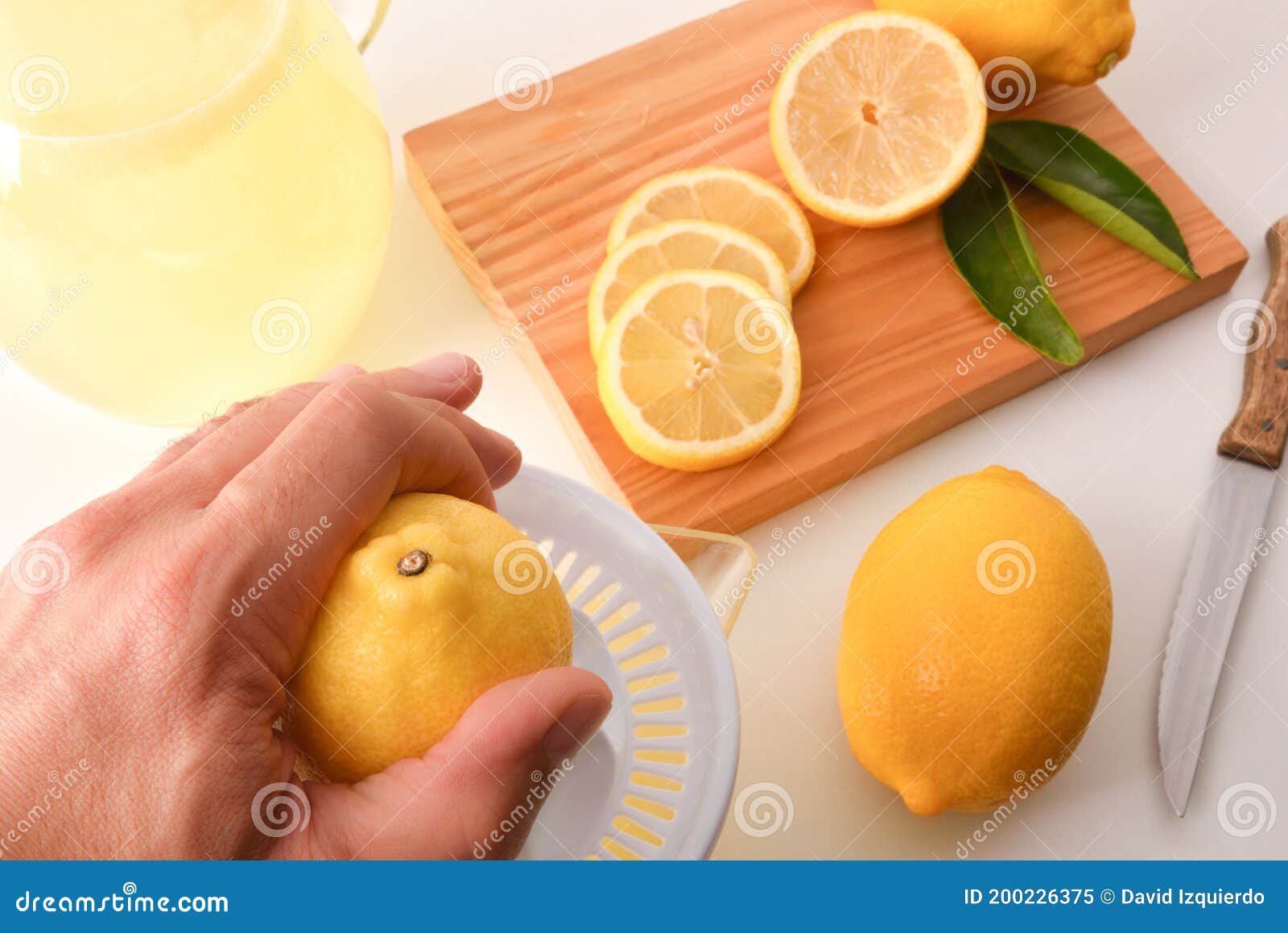 Hand Squeezing a Lemon on Bench Top Elevated View Stock Image - Image ...