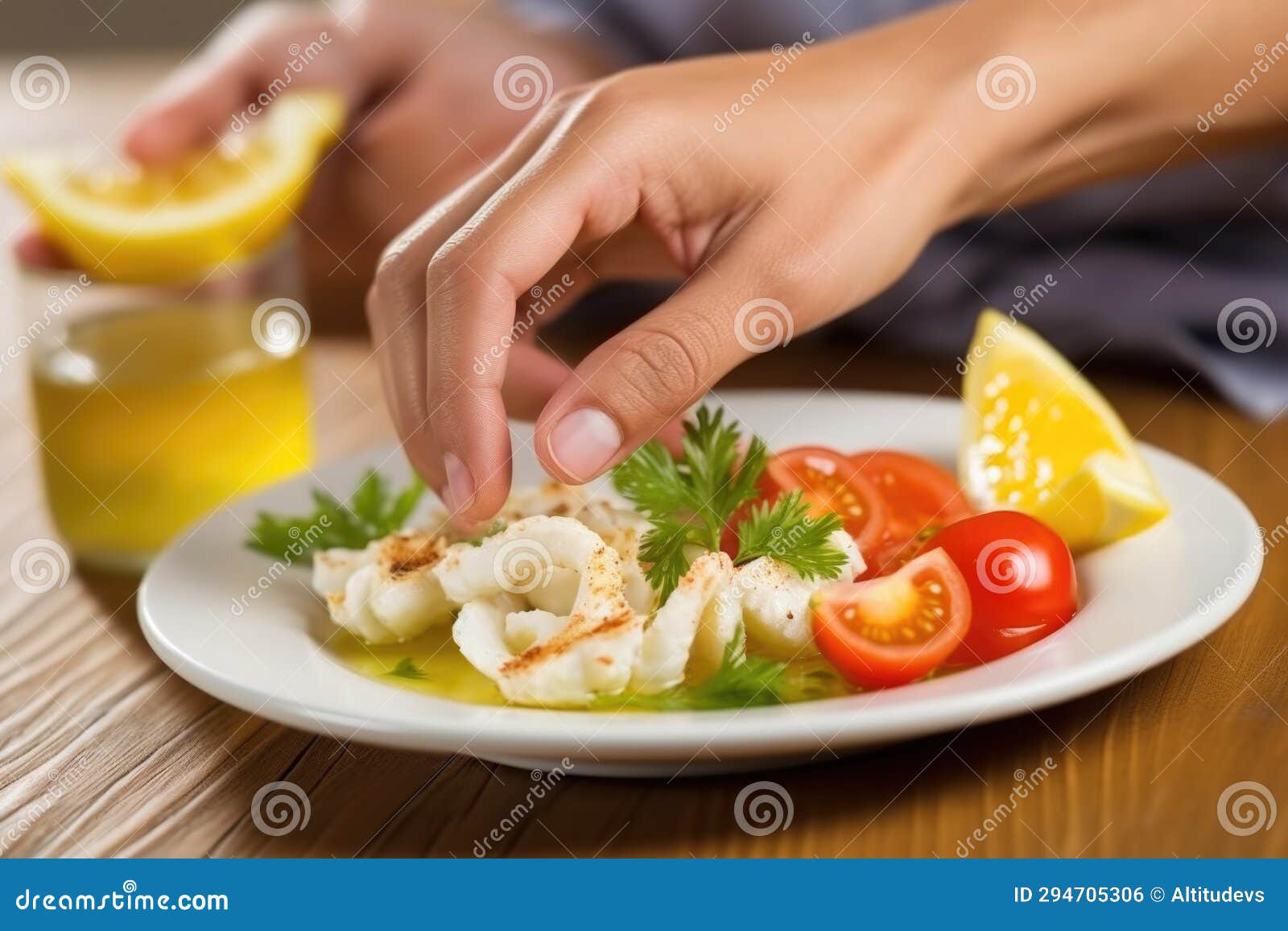 Hand Squeezing a Lemon Wedge Over a Calamari Salad Stock Illustration ...