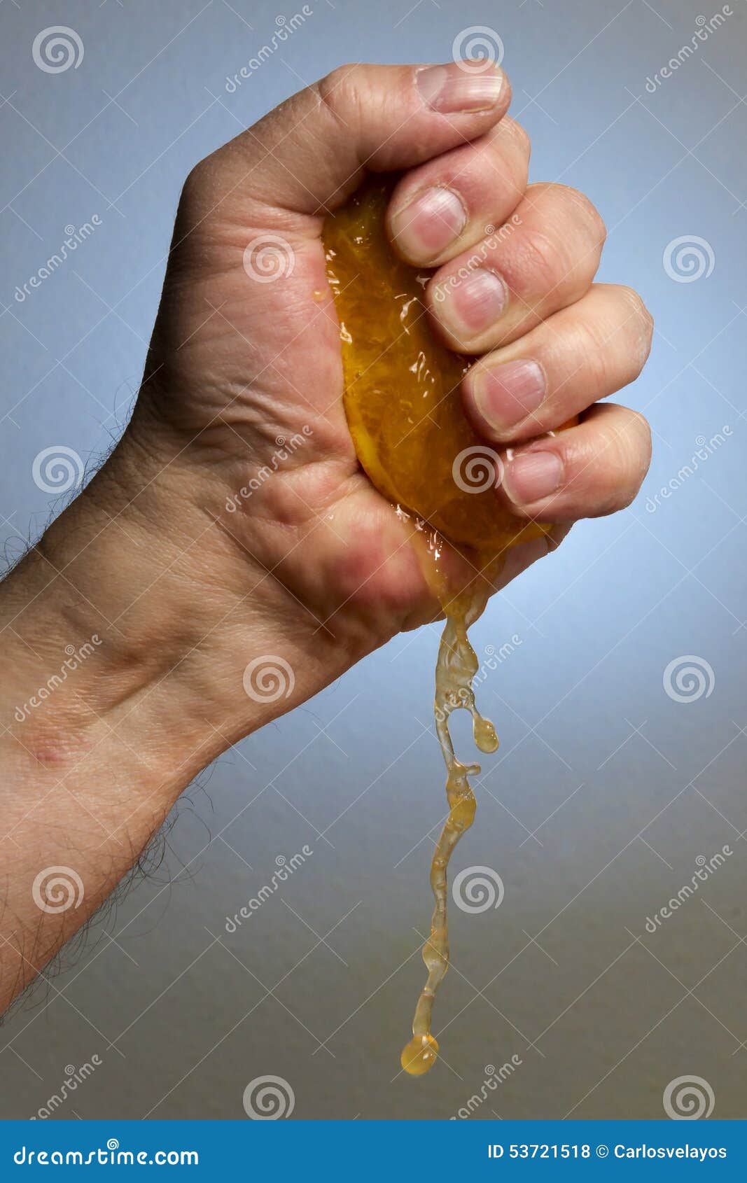 Hand Squeezing an Orange stock photo. Image of ripe, hand - 53721518