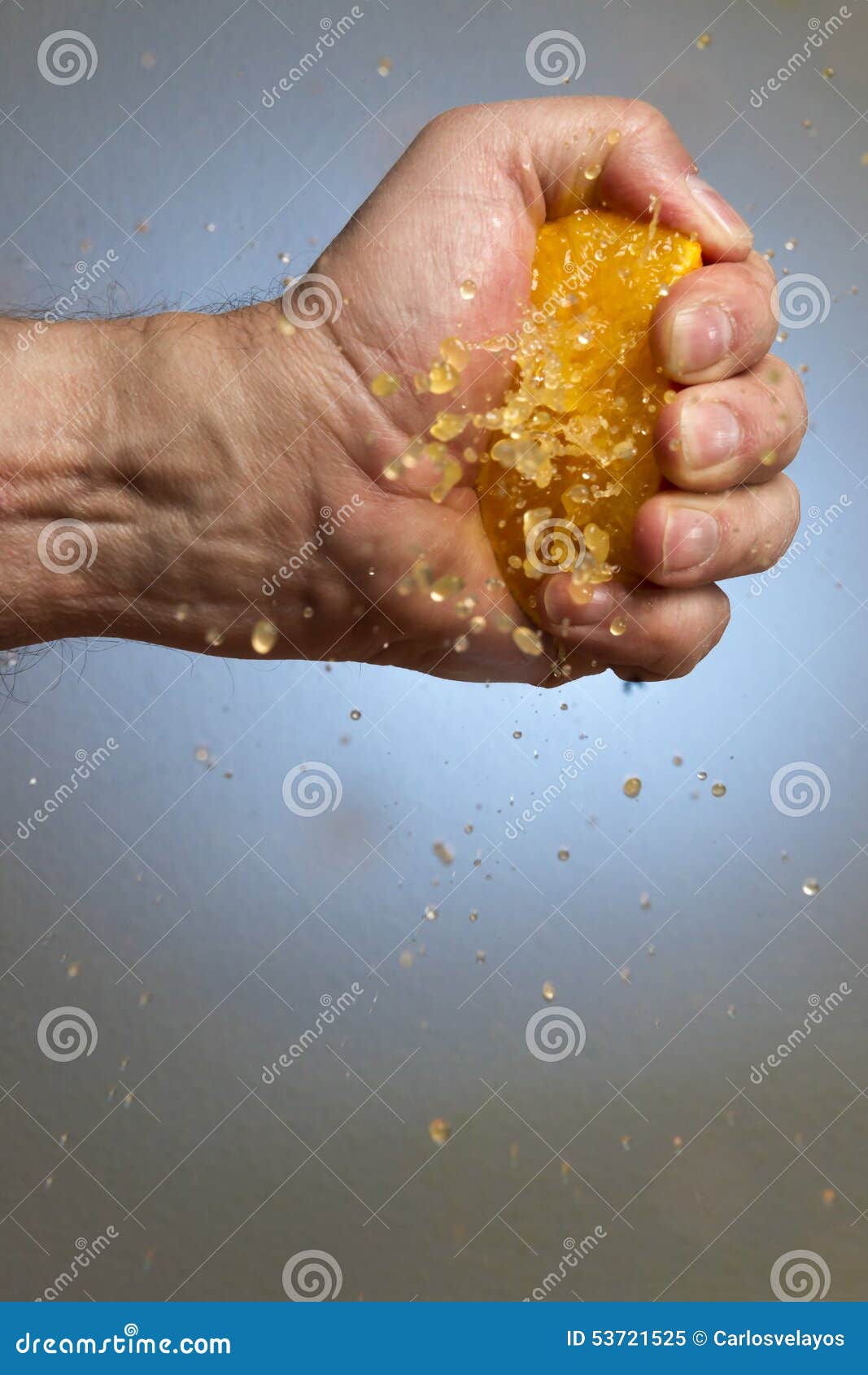 Hand Squeezing an Orange stock image. Image of drink - 53721525