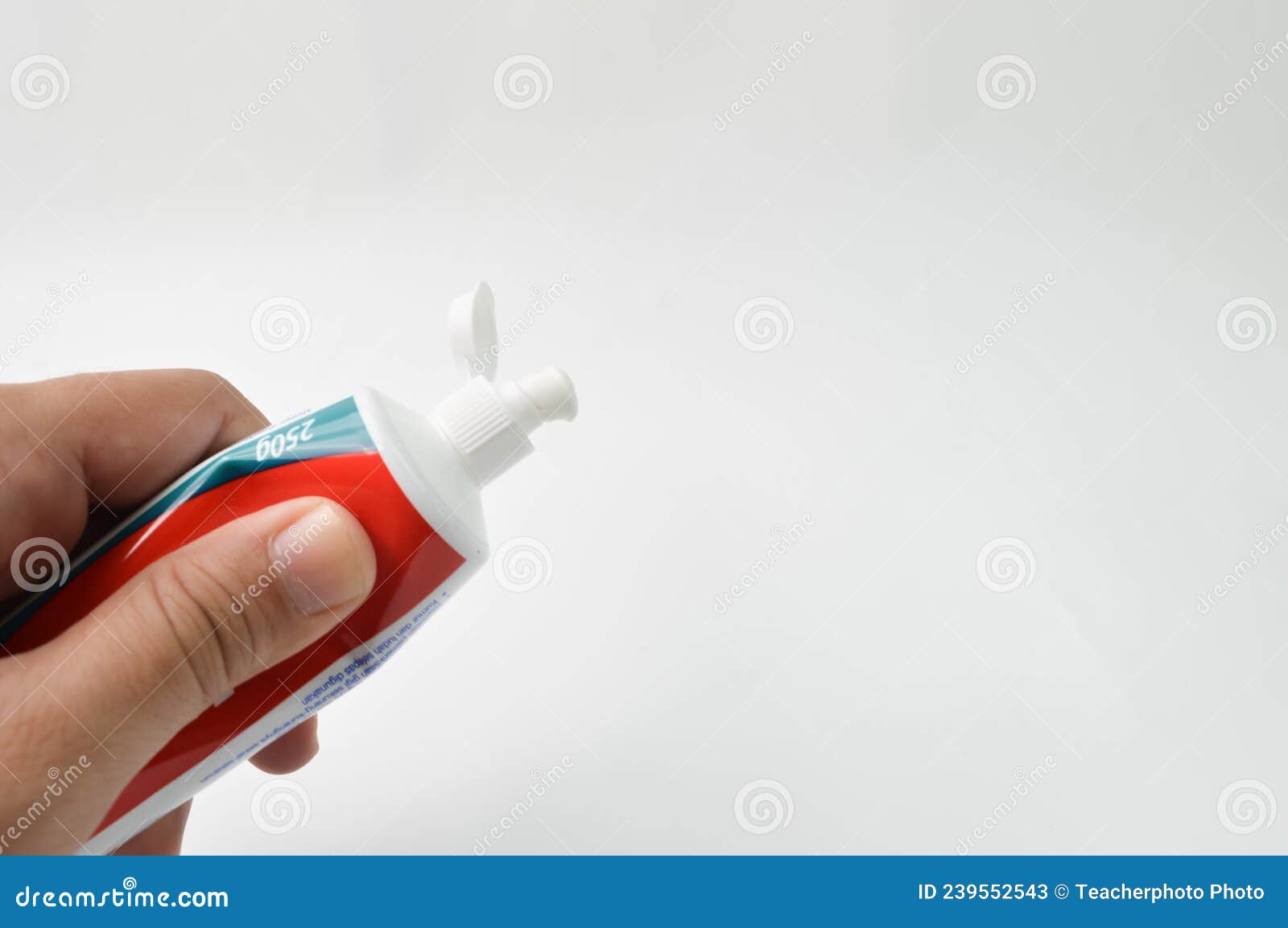 Hand Squeezing Toothpaste on a White Background Stock Image - Image of ...