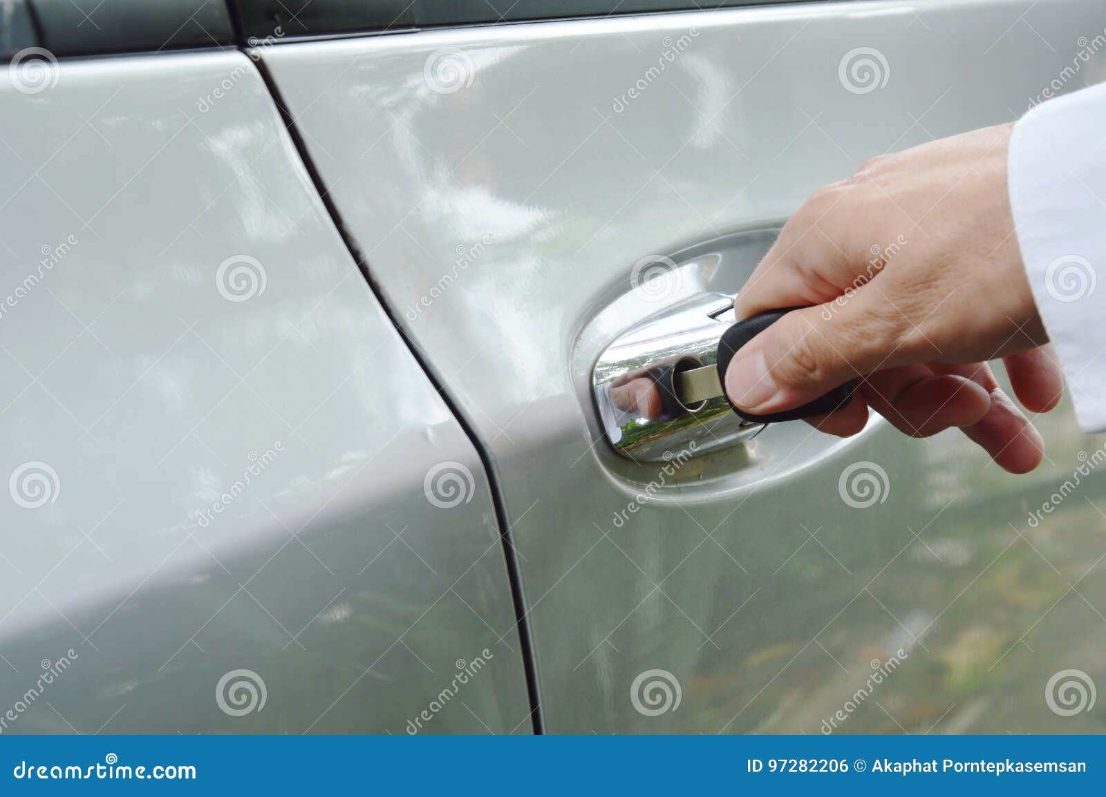 Hand Stabbing Car Key In Handle Hole And Twist For Open Door Royalty ...