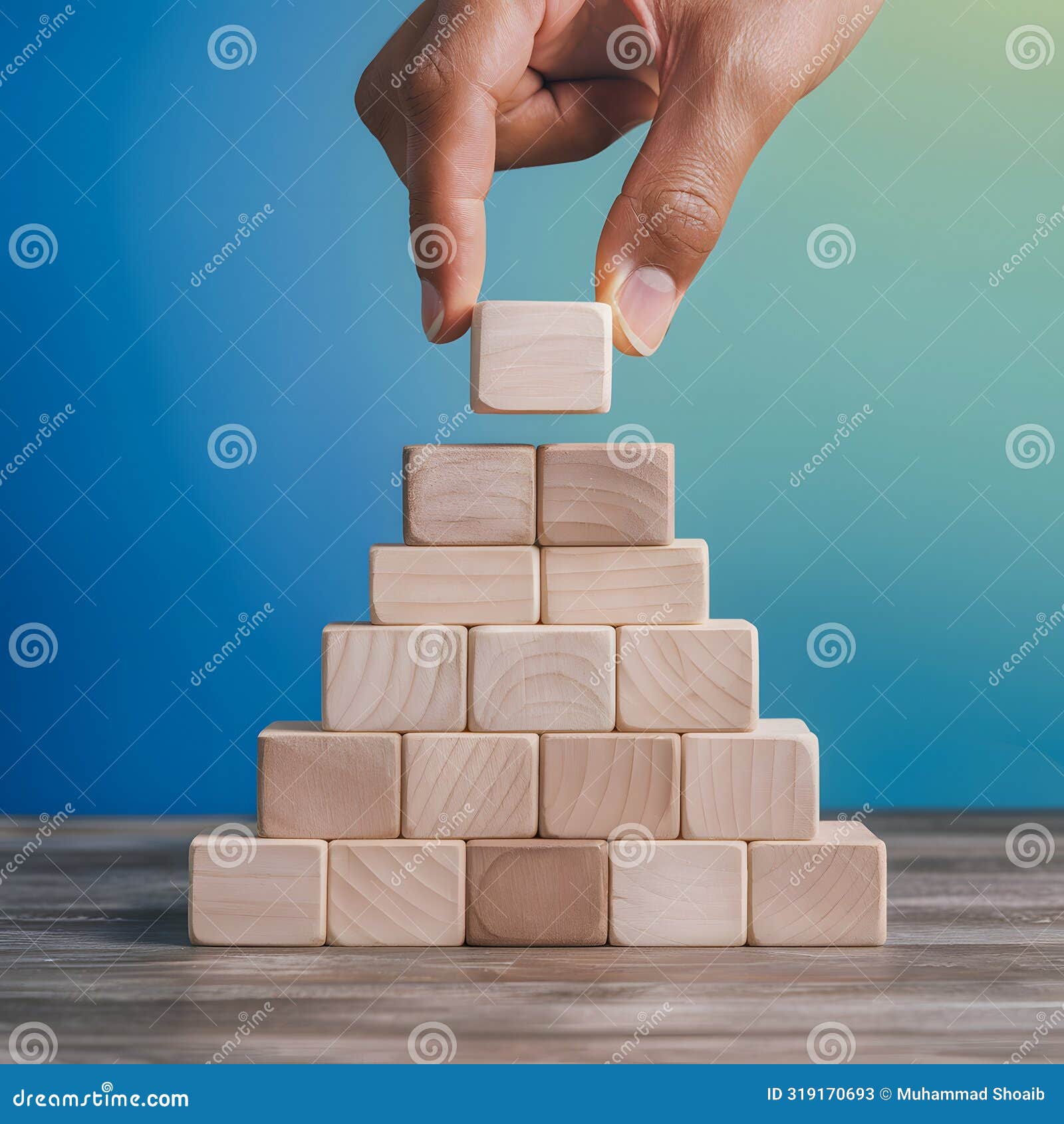 Hand Stacking Block on Pyramid, Representing Personal Growth and ...