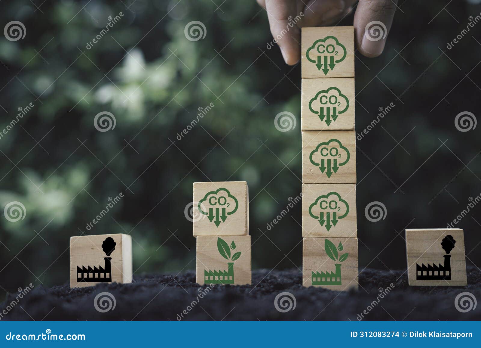 Hand Stacking CO2 Reducing Icon on Green Factory for Decrease CO2 , Carbon Footprint and Carbon ...