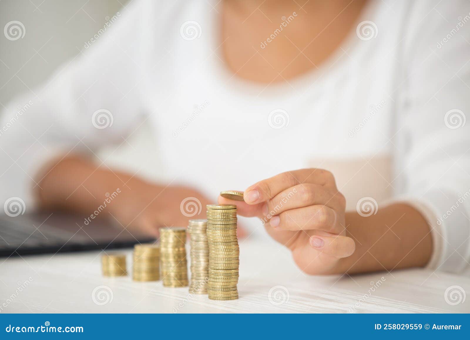 Hand stacking coin on desk stock image. Image of inflation - 258029559