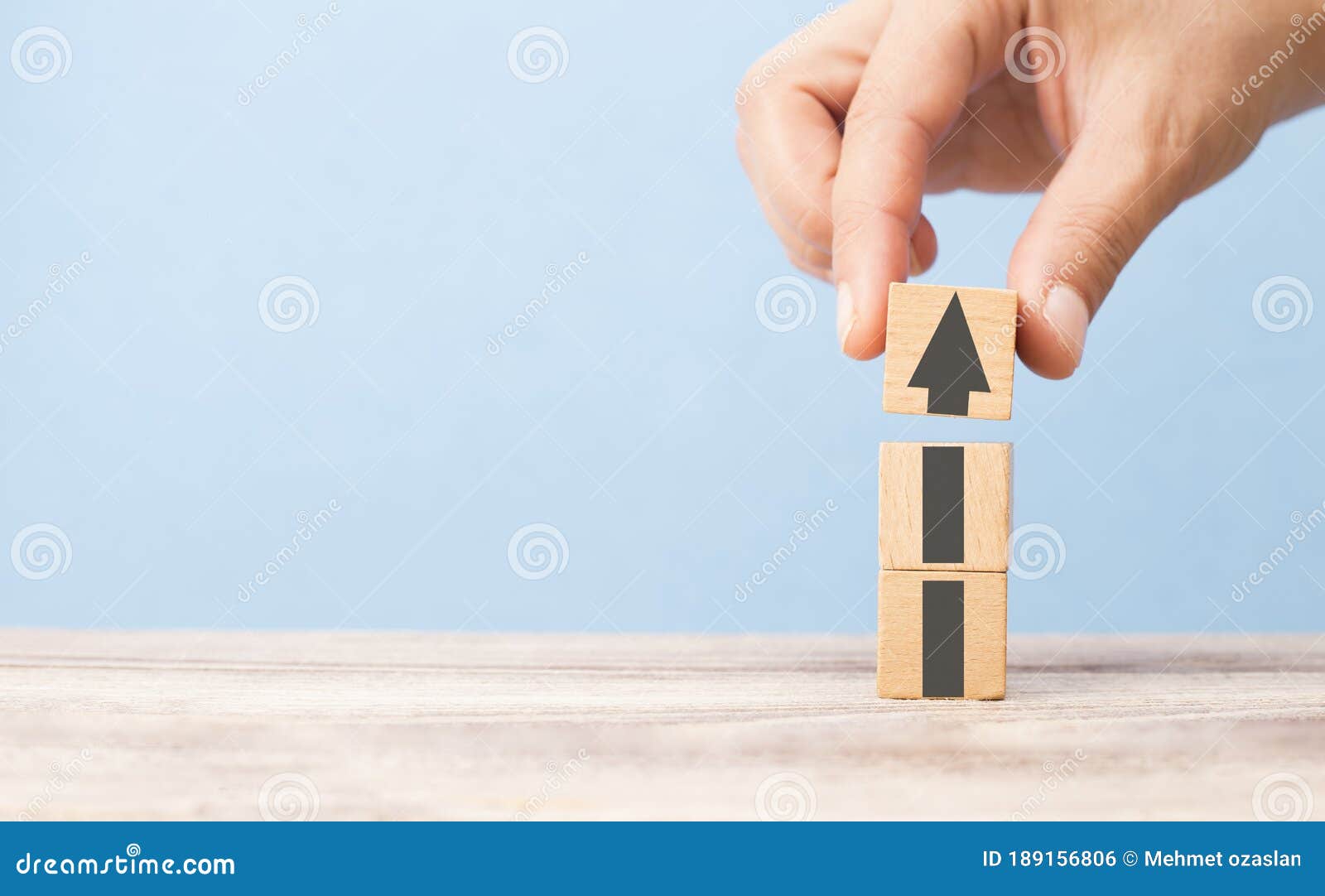 Hand Stacking Cubes in a Row, Arrow Symbol Pointing Up Stock Photo ...