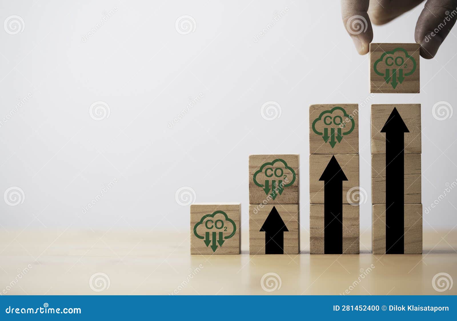 Hand Stacking Increasing of CO2 Reducing Icon on Cube for Decrease CO2 , Carbon Footprint and ...