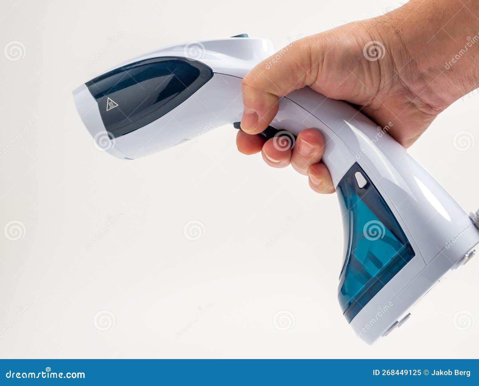In Hand Steamer for Clothes on a White Background. Portable Iron Stock ...