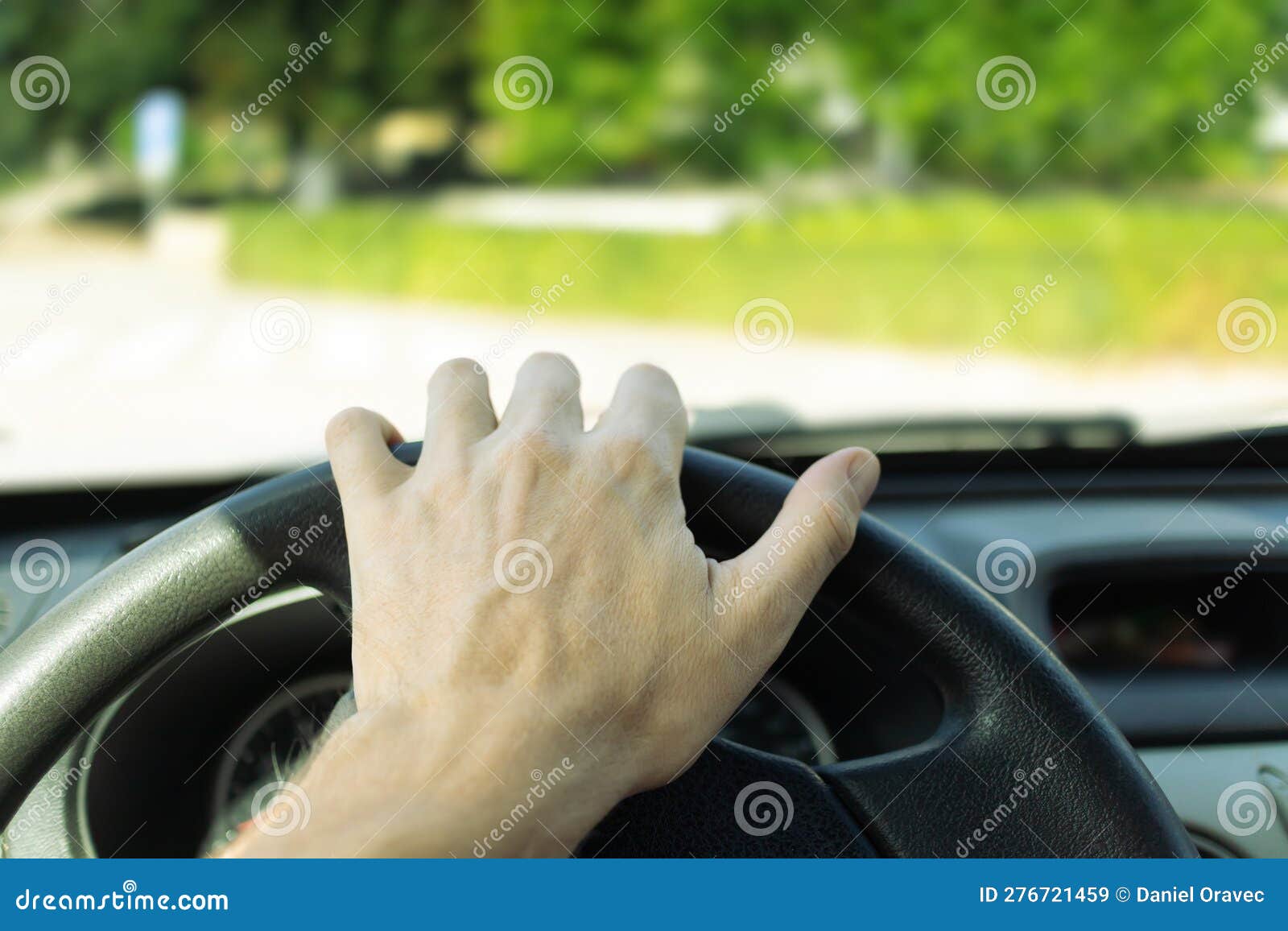 Hand on Steering Wheel with Street and Park Stock Image - Image of ...