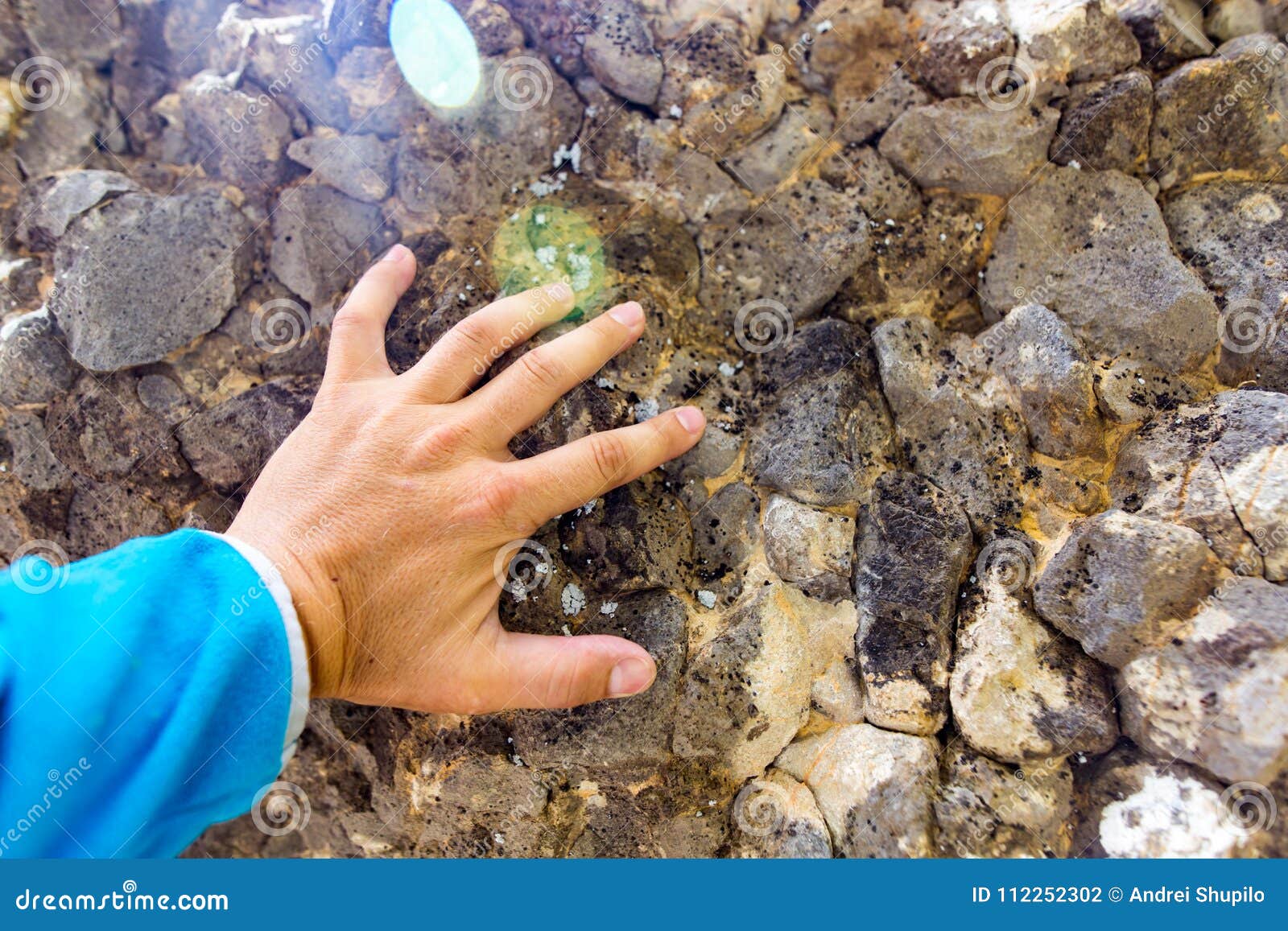 Hand on a Stone Wall in the Mountains Stock Photo - Image of white ...
