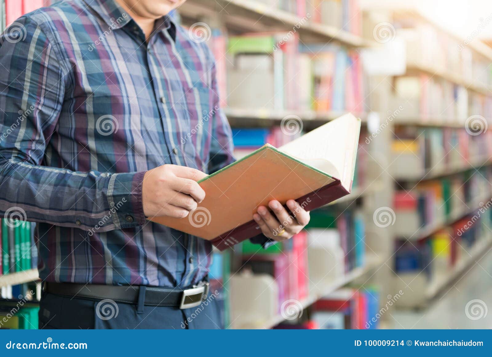 Hand Student Holding Book and Library Background. Stock Photo - Image ...