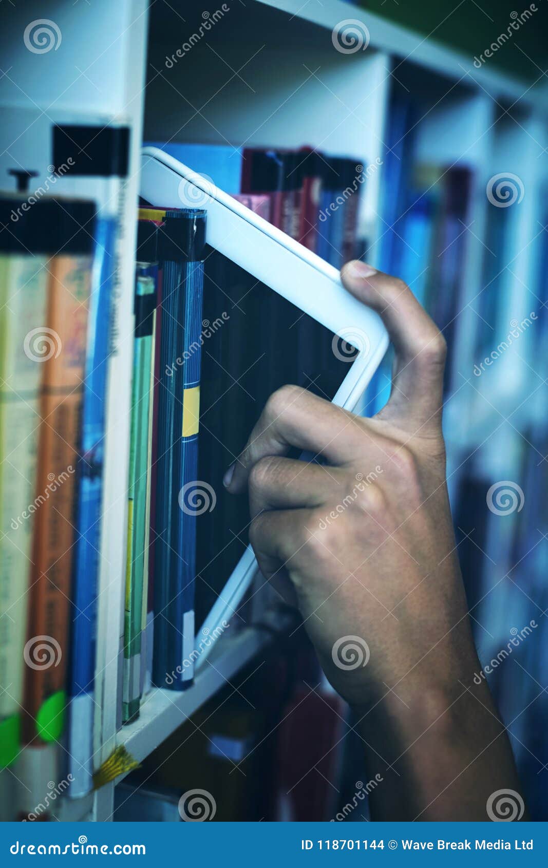 Hand of Student Keeping Digital Tablet in Bookshelf in Library Stock ...