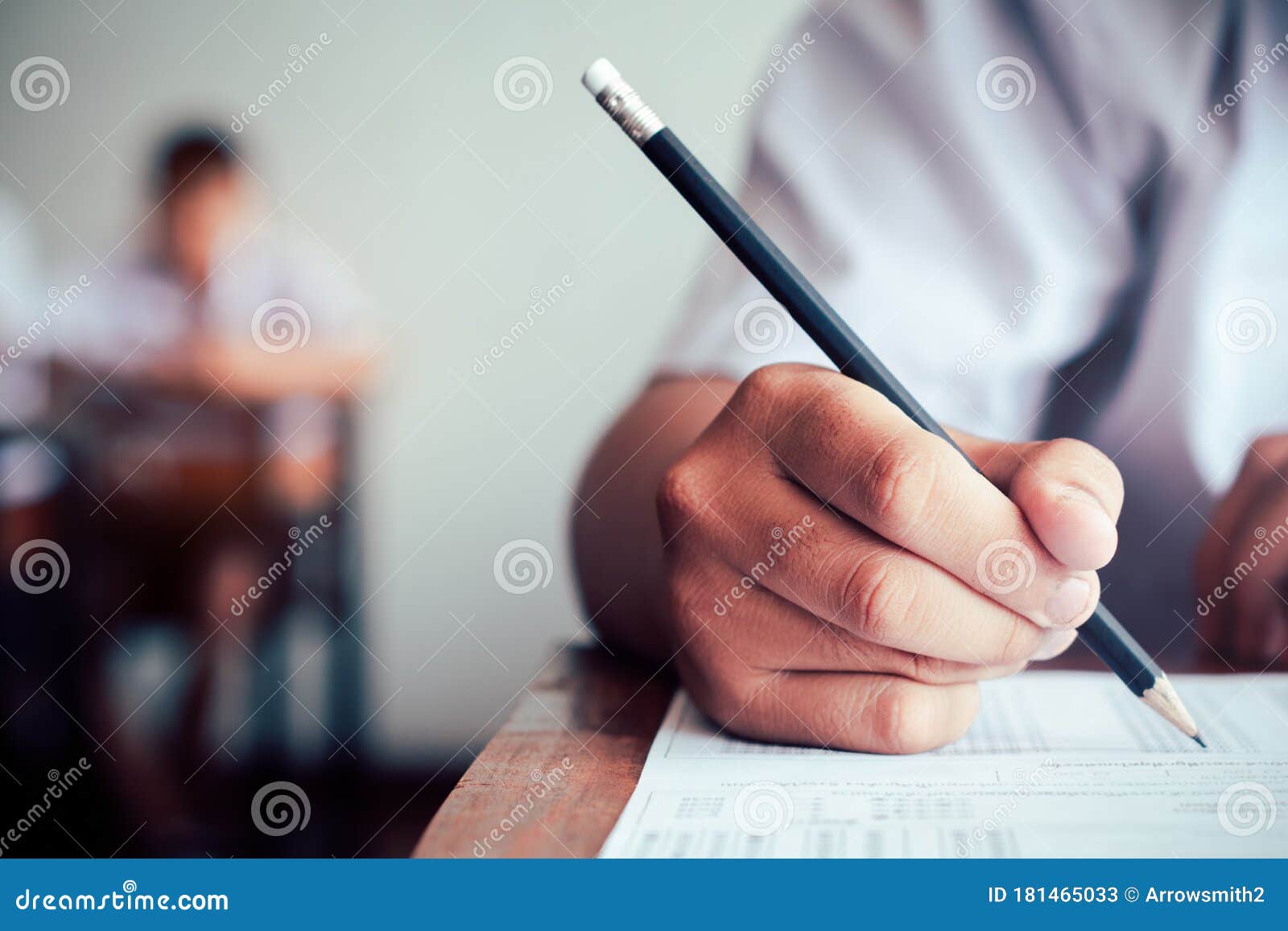 Hand of Student is Taking Exam and Writing Answer in Classroom for ...