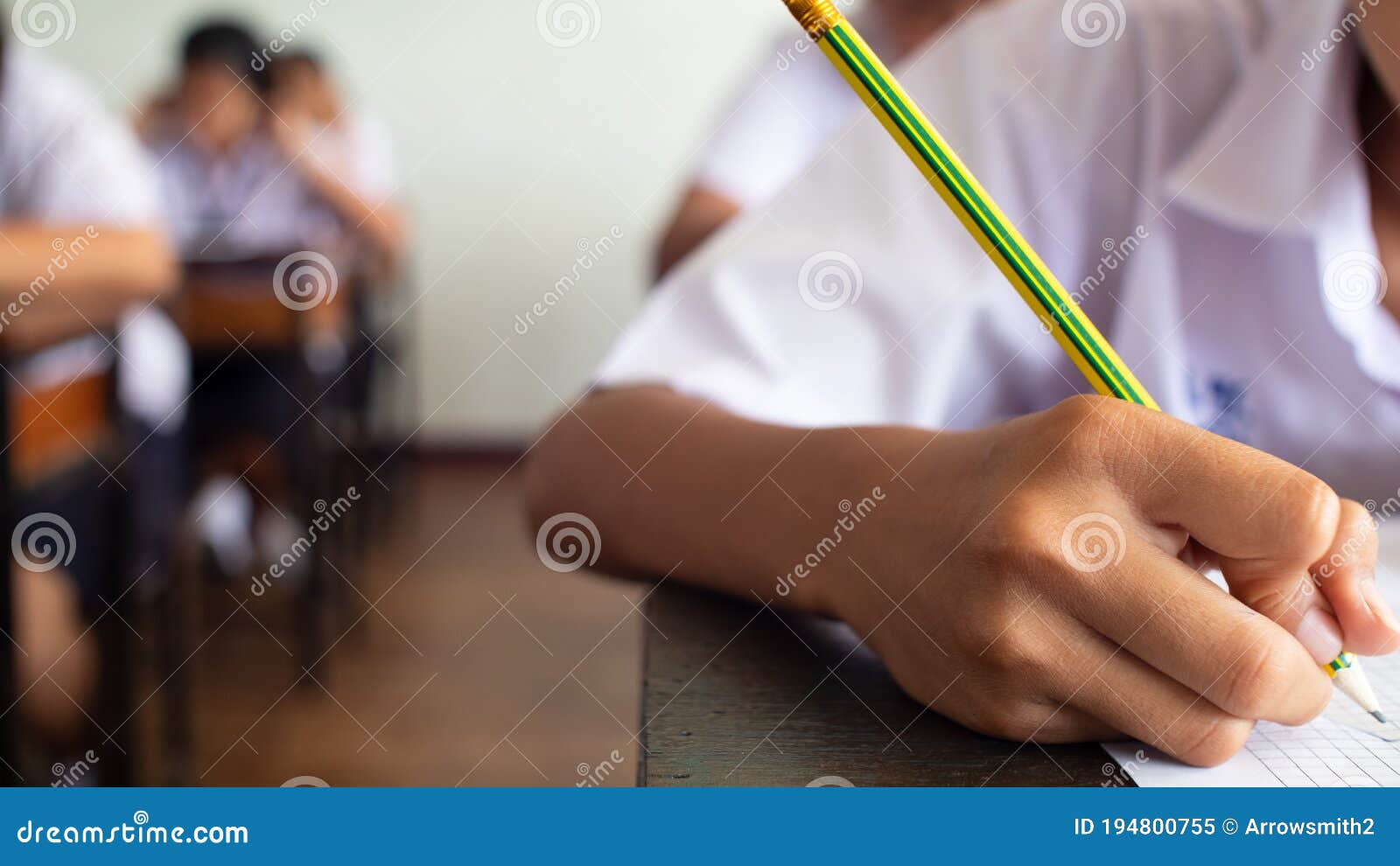 Hand of Students Writing and Taking Exam with Stress in Classroom.16:9 ...