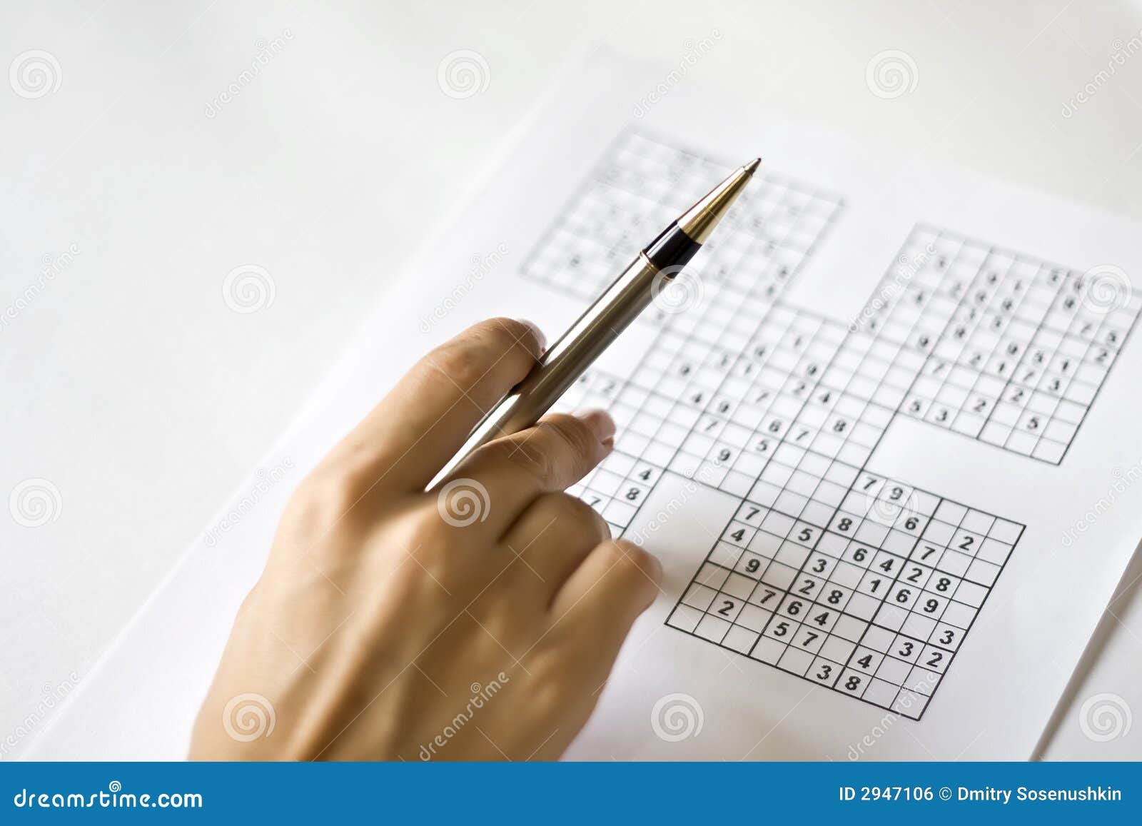 A hand on sudoku grid stock photo. Image of puzzle, sudoku - 2947106