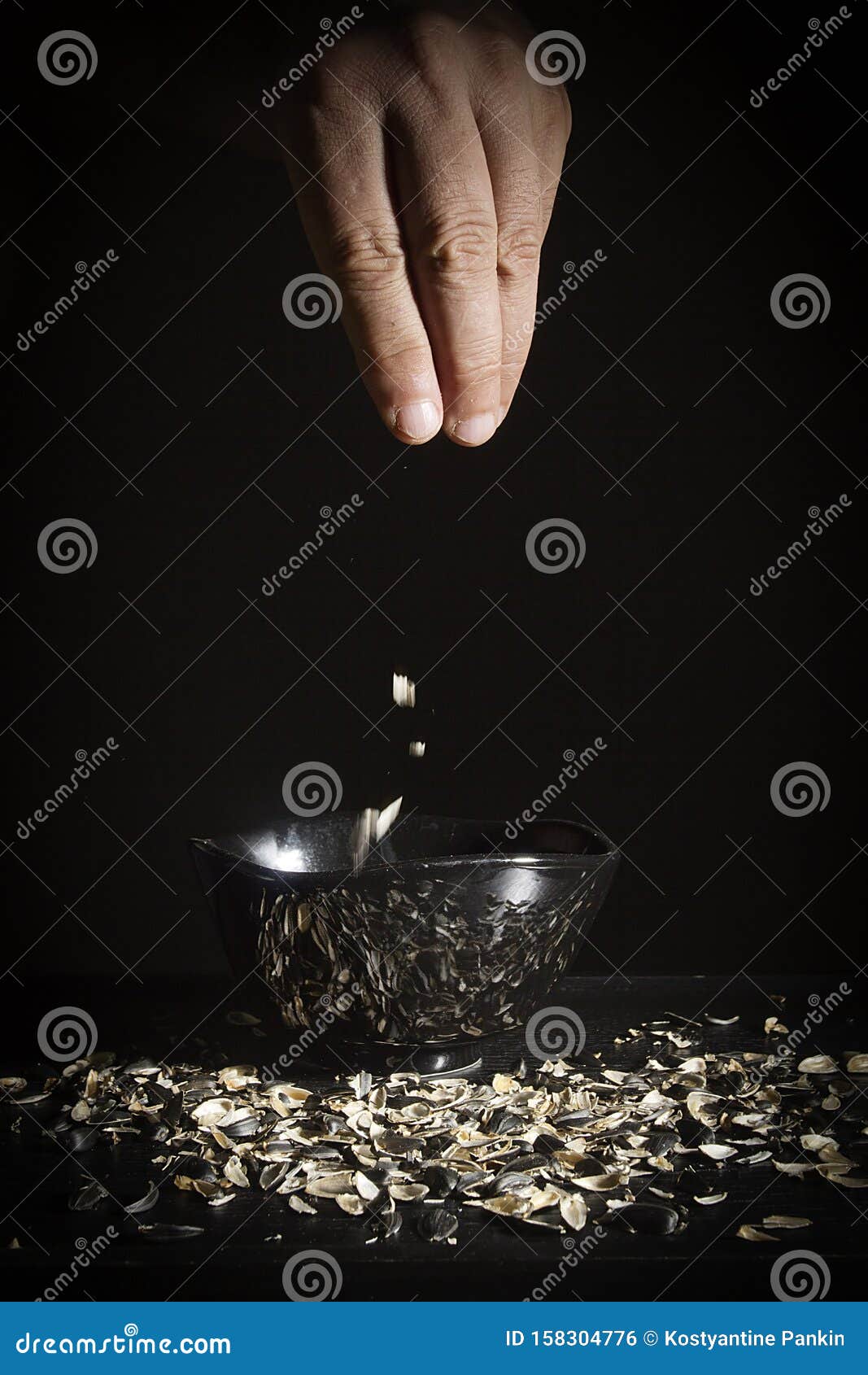 Hand with sunflower husk stock photo. Image of symbol - 158304776