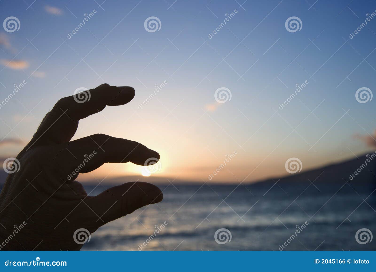 Hand with sunset. stock photo. Image of scenic, pacific - 2045166