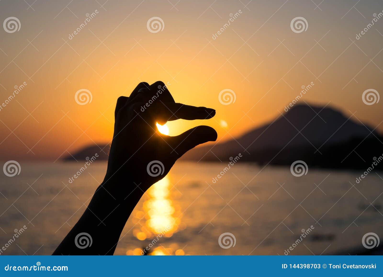 Hand on sunset stock image. Image of contrasts, beauty - 144398703