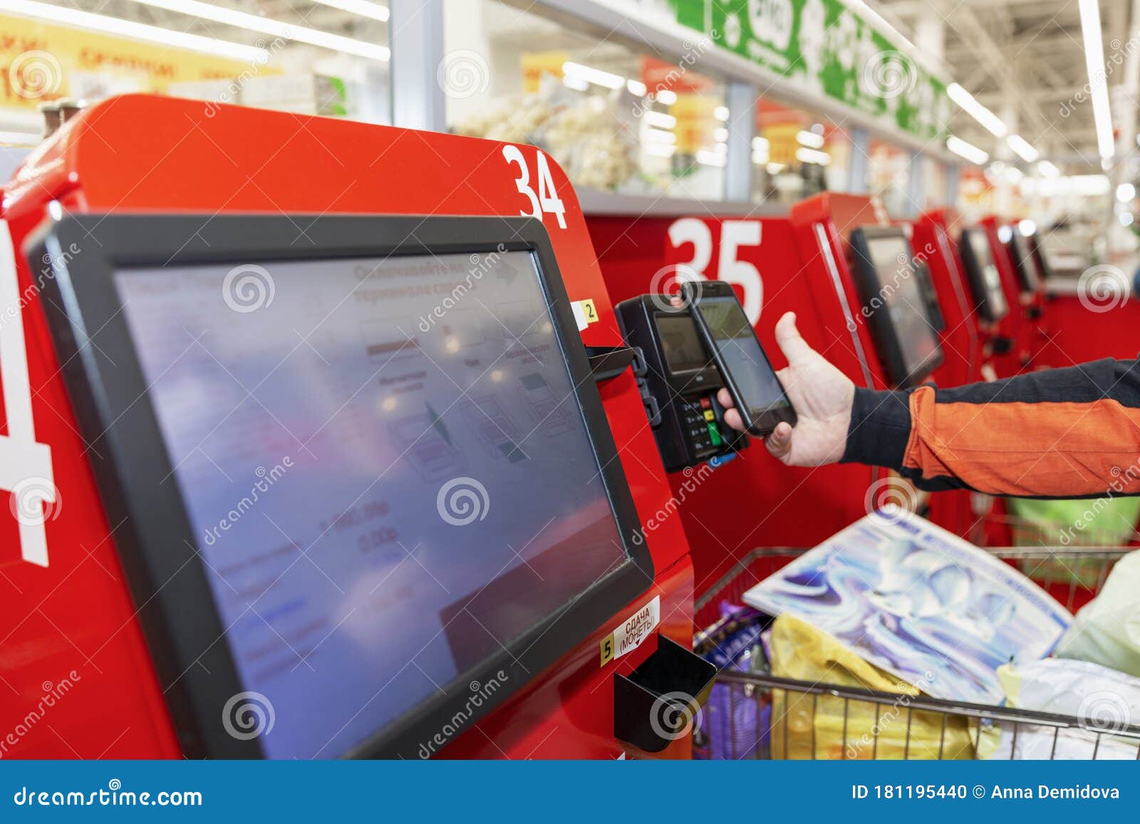Moscow, Russia, 04/07/2020:Hand at a Supermarket Checking Out by Using ...
