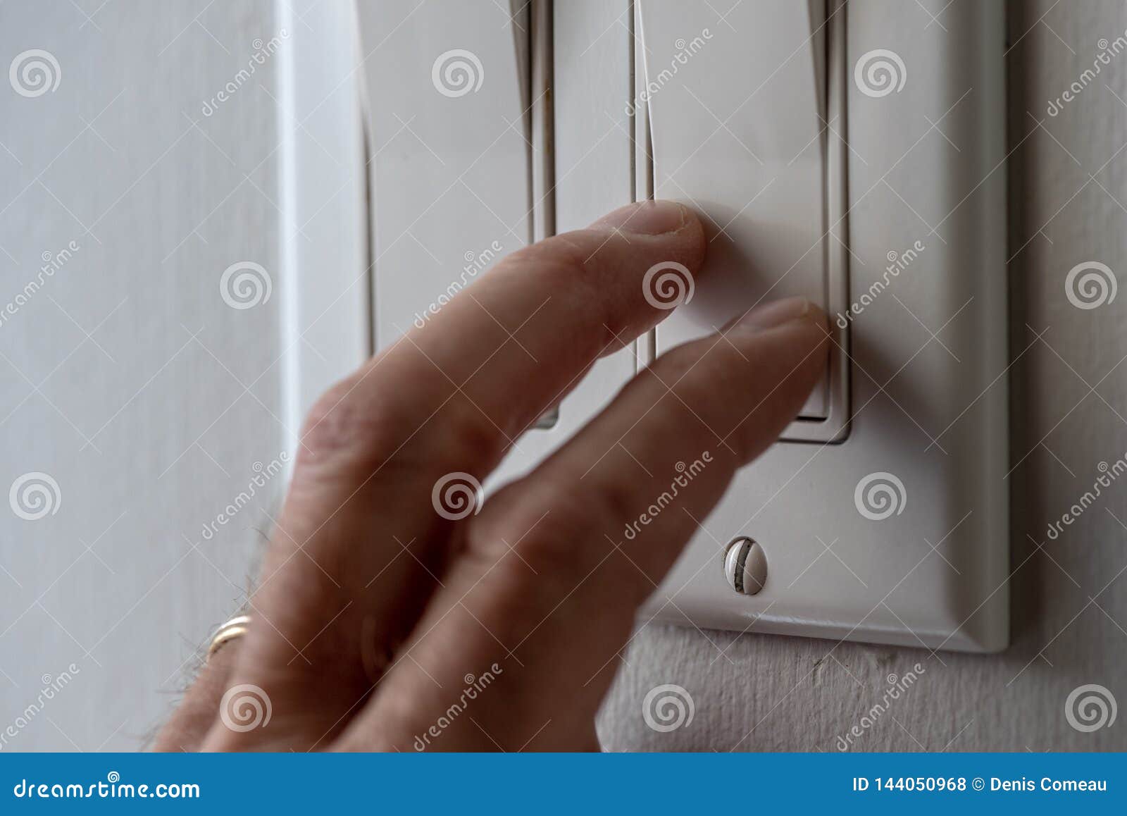Hand switching off lights. stock photo. Image of closeup - 144050968