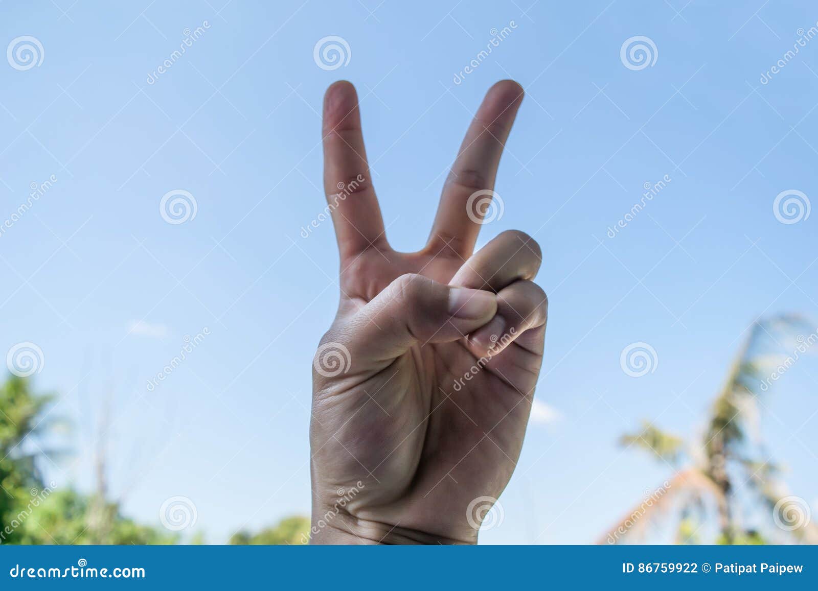 The Hand Symbol Two Fingers on Blue Sky Background Stock Photo - Image ...