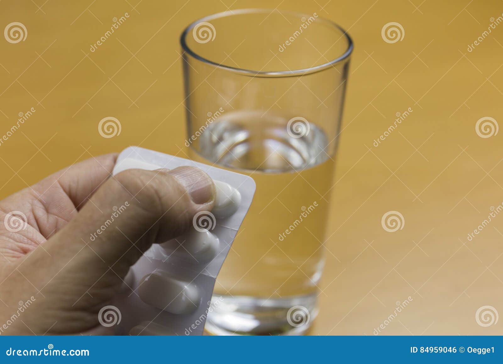 Hand with Tablets and a Glass of Water Stock Photo - Image of hand ...