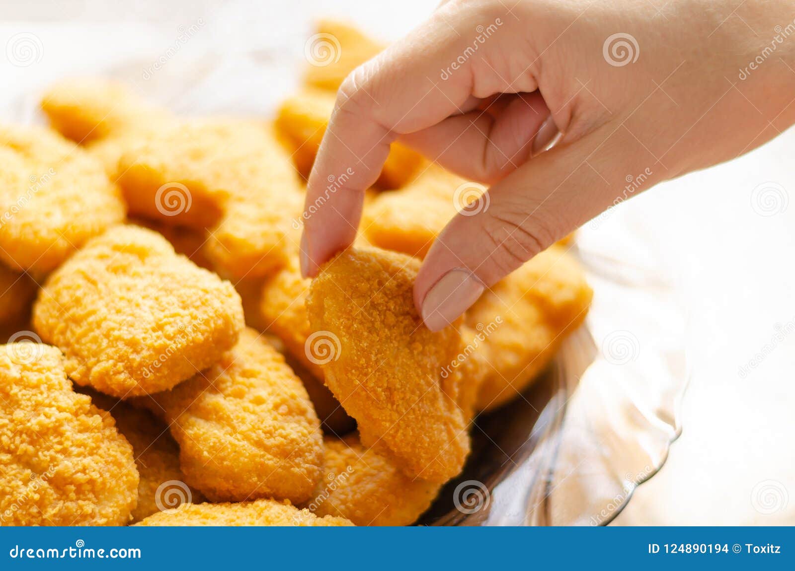 Hand Take Golden Deep Fried Chicken Nuggets, Fast Snacks Stock Photo ...