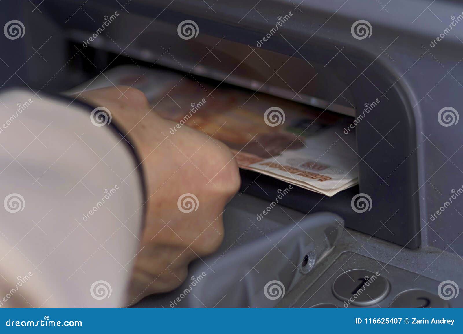 The Hand Takes a Bundle of Money from the Open ATM Receiver Stock Image ...