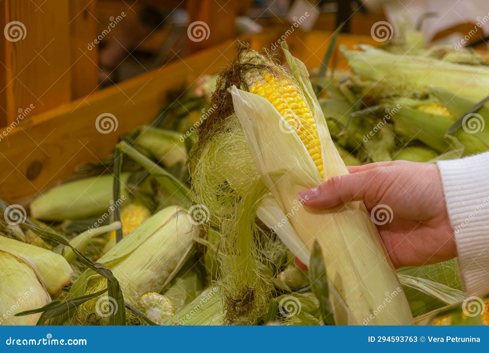 Hand Taking Corn from Grocery Store Shelf Stock Image - Image of hand ...