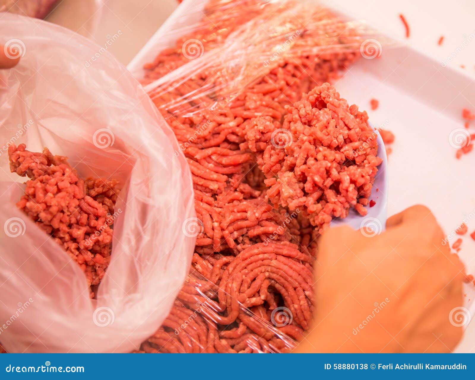 Hand Taking Ground Beef into a Plastic Bag Stock Photo - Image of ...