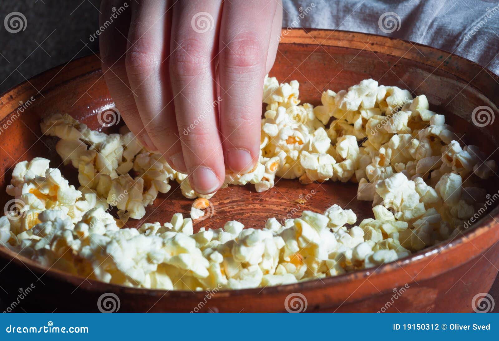 Hand taking out popcorn stock photo. Image of natural - 19150312