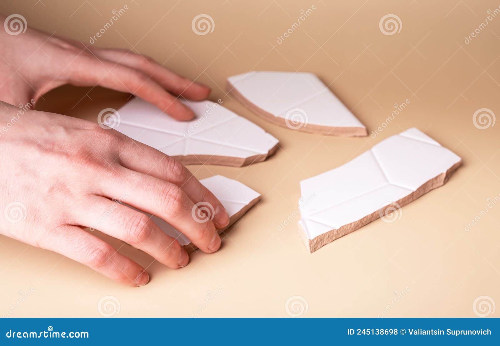 Hand Taking Pieces Of Broken Tile. Touch Sense And Taction Concept ...